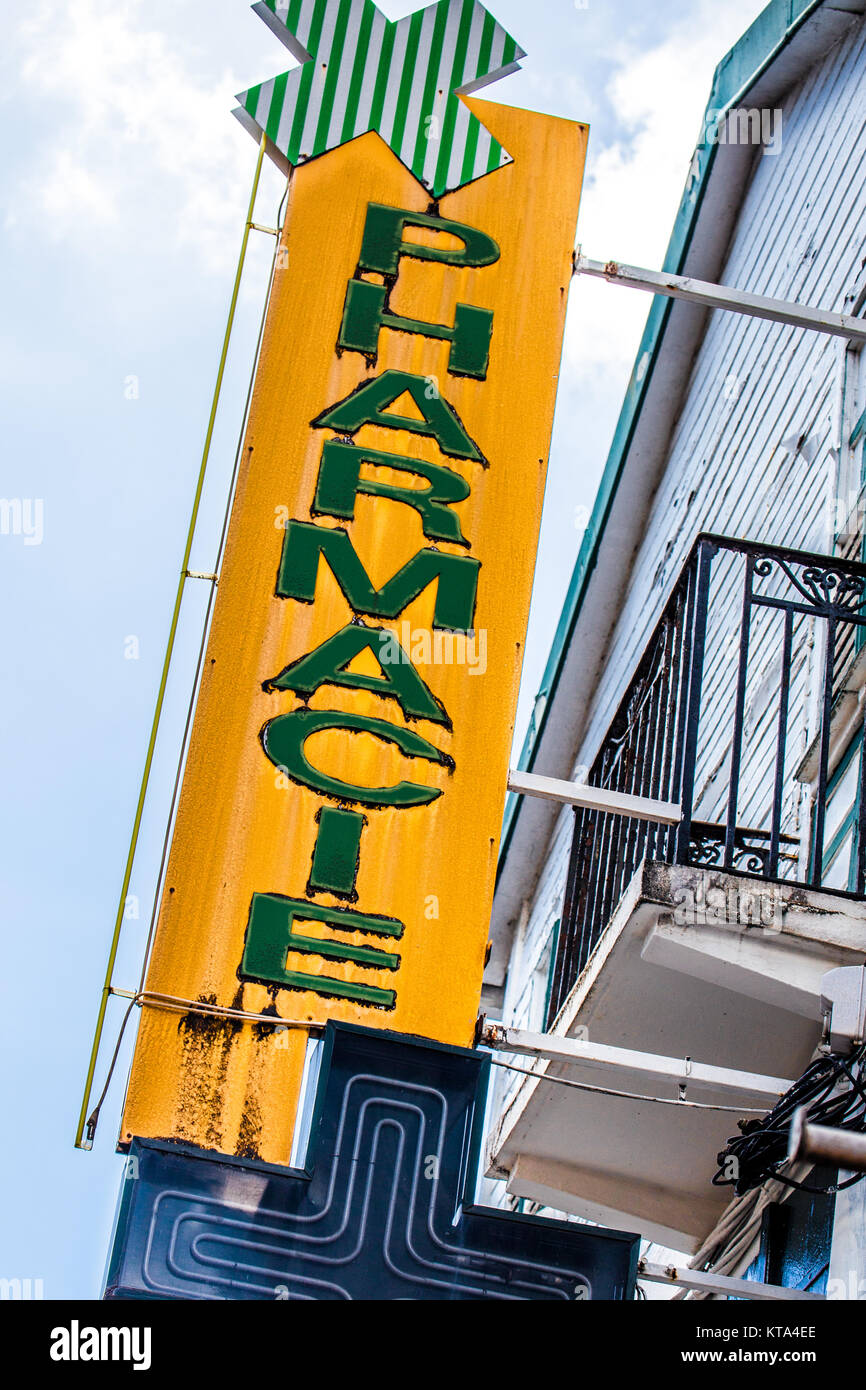 Metal Pharmacy Sign Painted in Yellow with Neons Stock Photo - Alamy