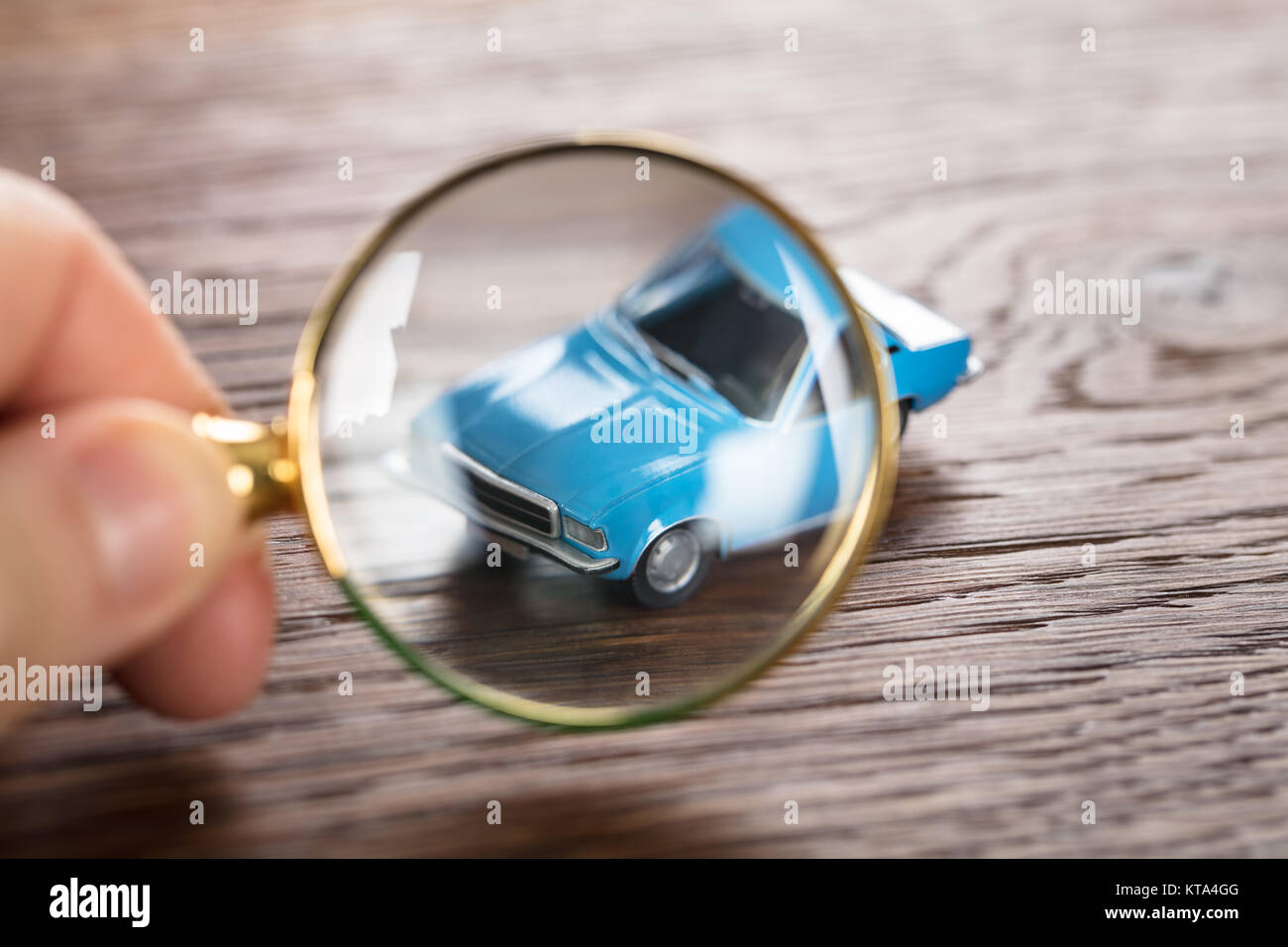 Person Scrutinizing A Car Model Stock Photo - Alamy