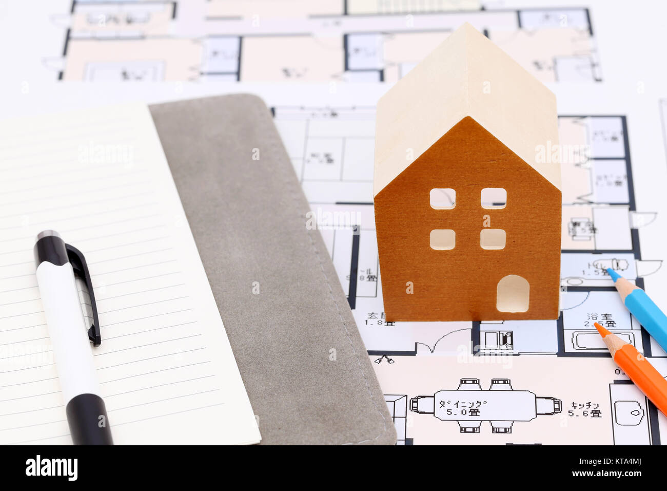 Miniature model of house on blueprints, construction plan Stock Photo ...