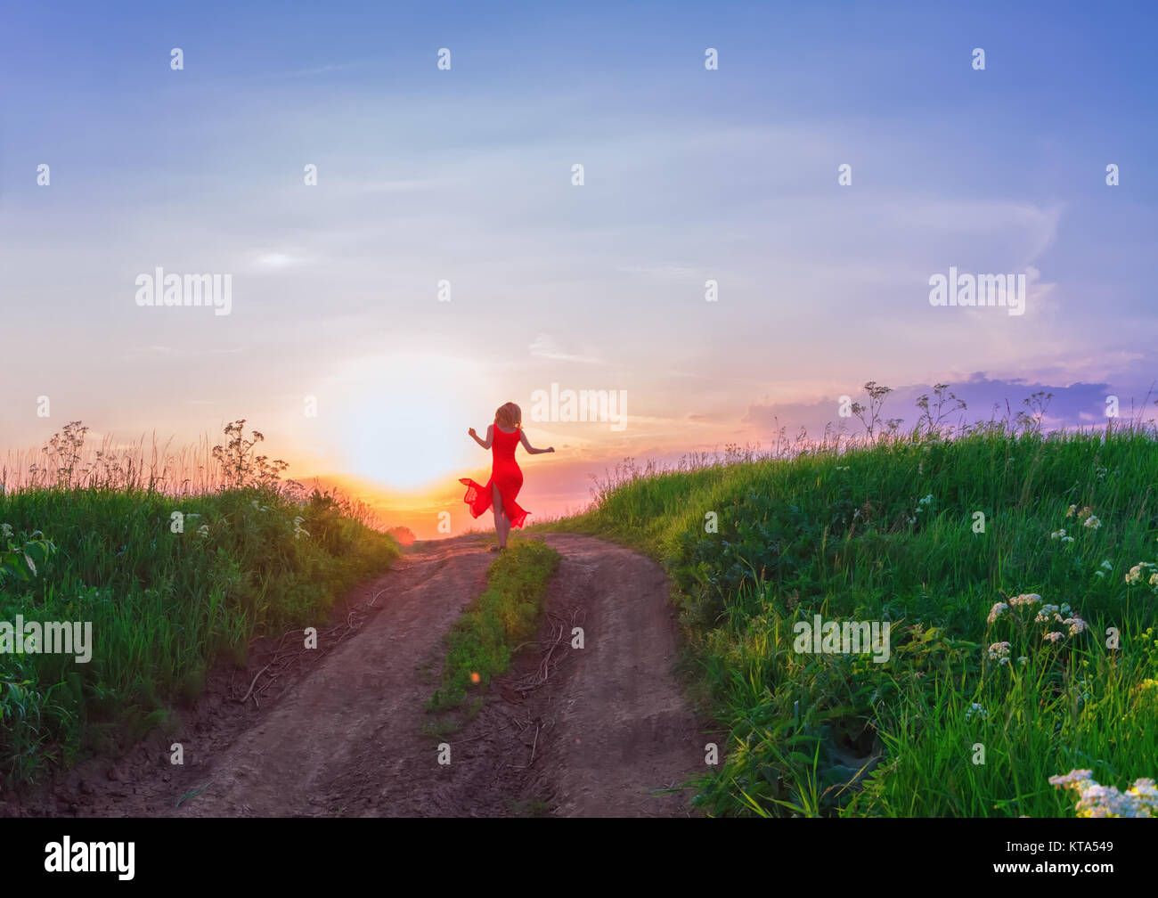 Young Woman Dancing Against The Sunset Stock Photo - Alamy