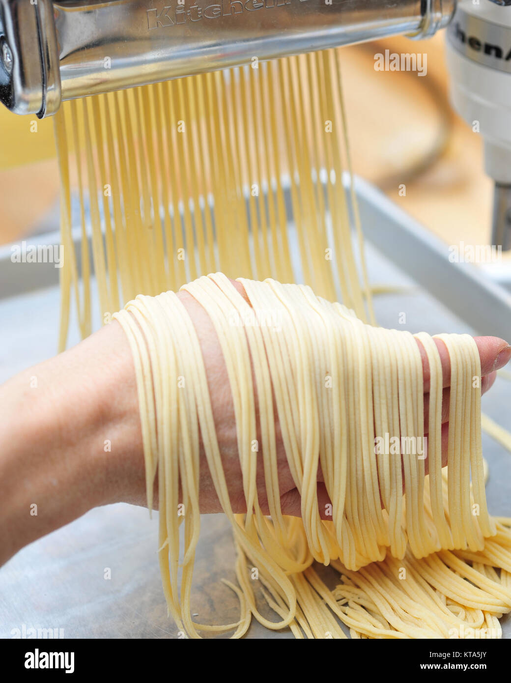 Fresh spaghetti pasta being made Stock Photo - Alamy