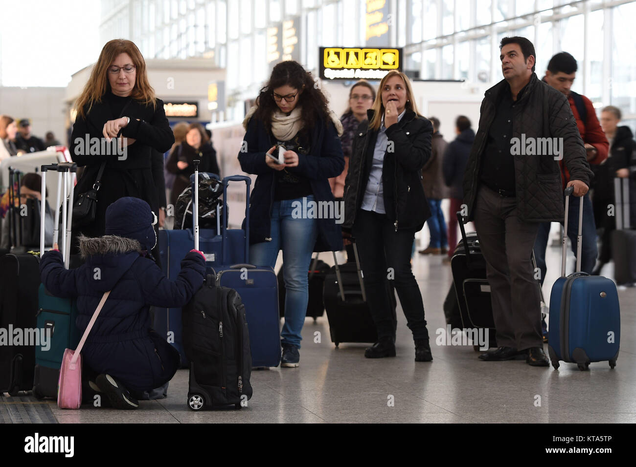 People view the check in information board at London Stansted Airport ...