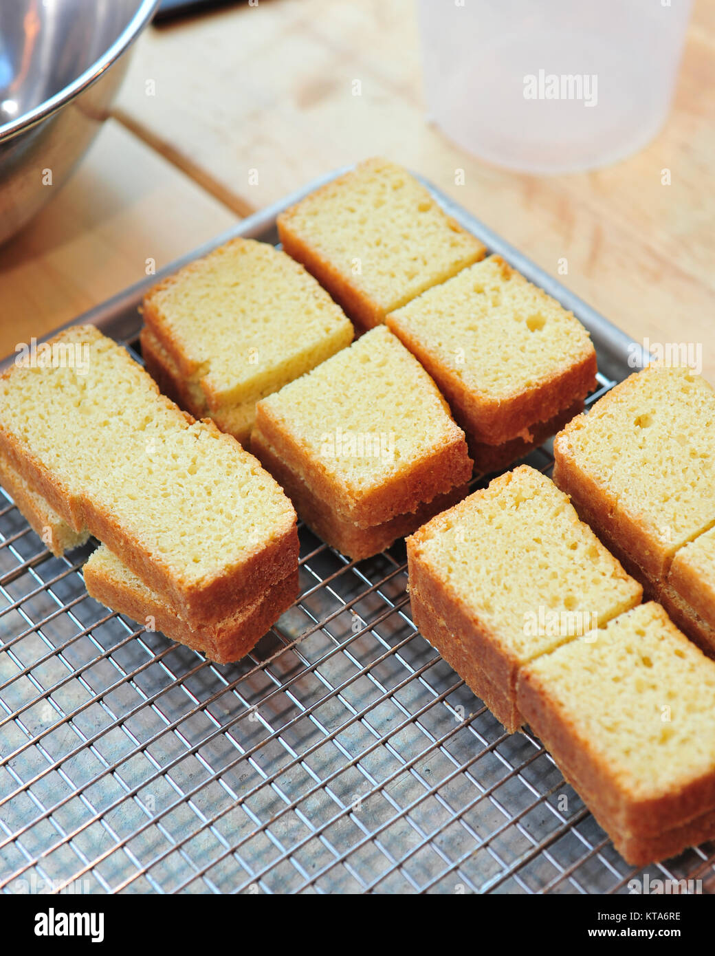 Pound cake being cut into squares Stock Photo - Alamy