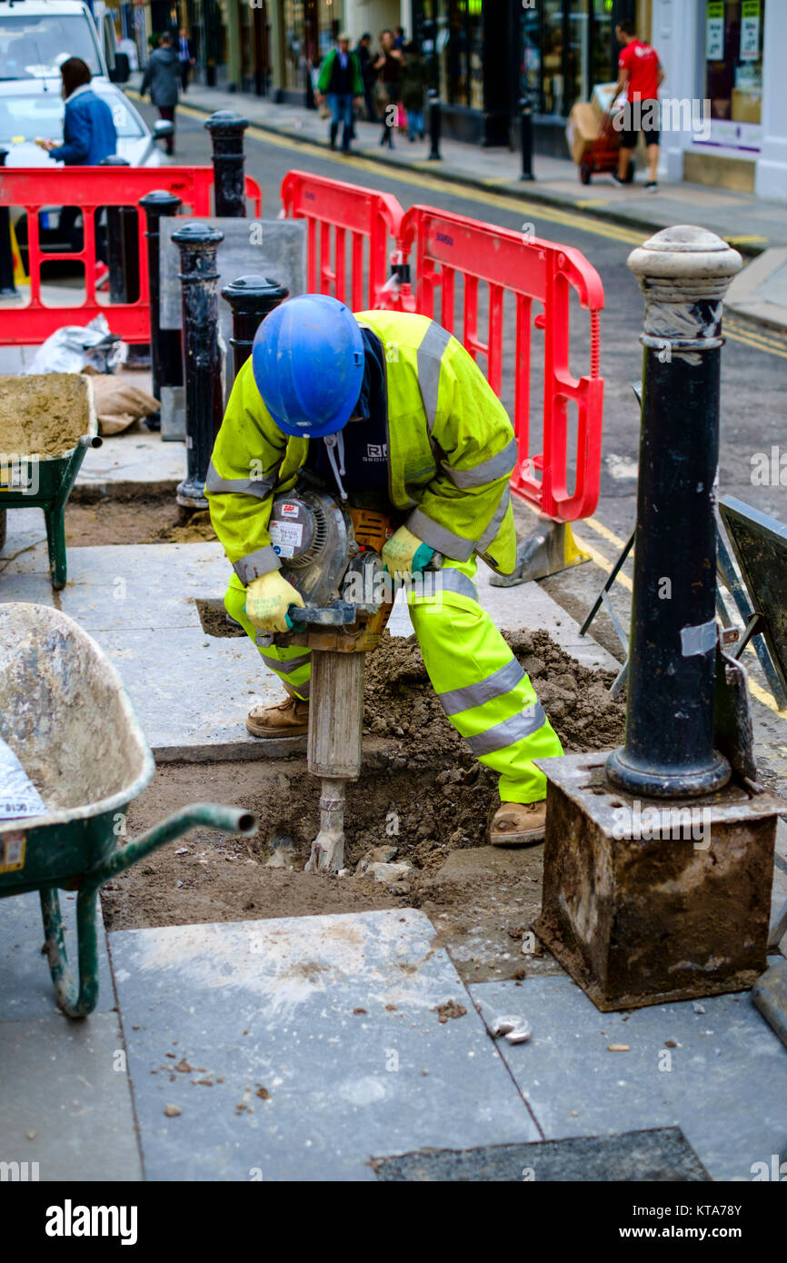 Man digging hole in road hi-res stock photography and images - Alamy