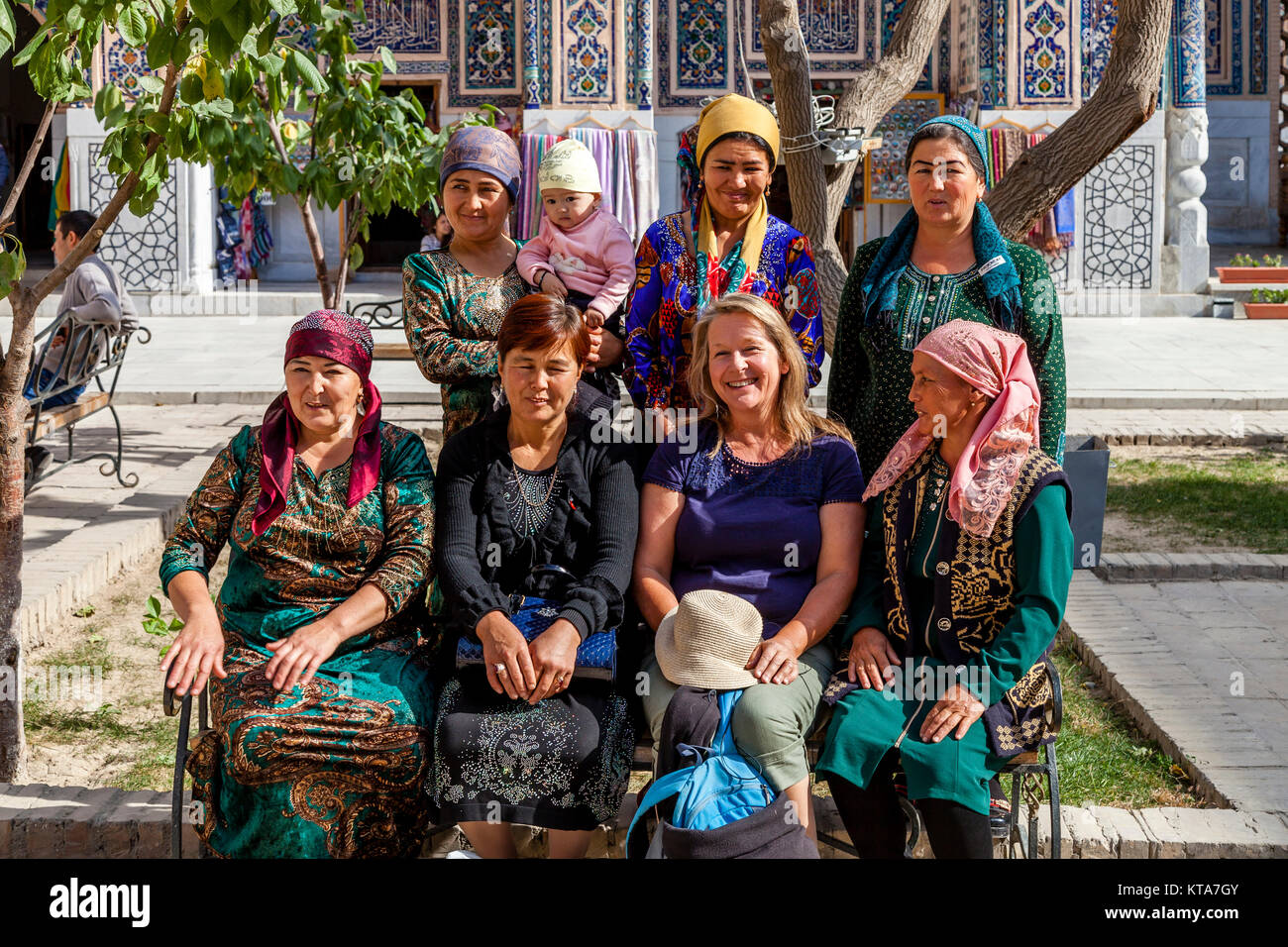 A European Tourist Poses For A Photograph With Local Uzbek Women, The ...
