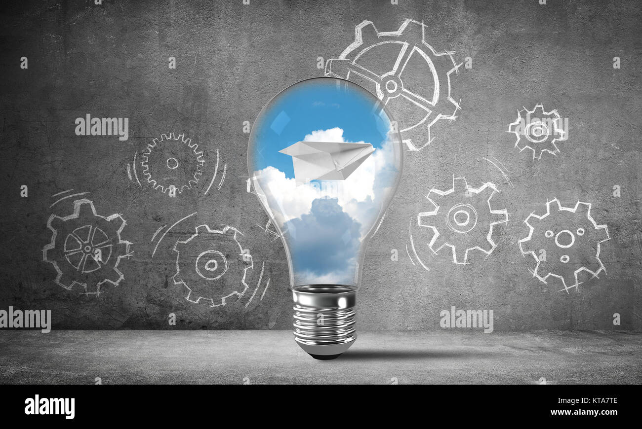 Lightbulb with paper plane and clouds inside placed against sketched ...