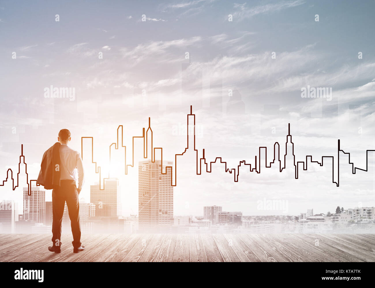 Businessman standing with back and looking at silhouette of modern ...