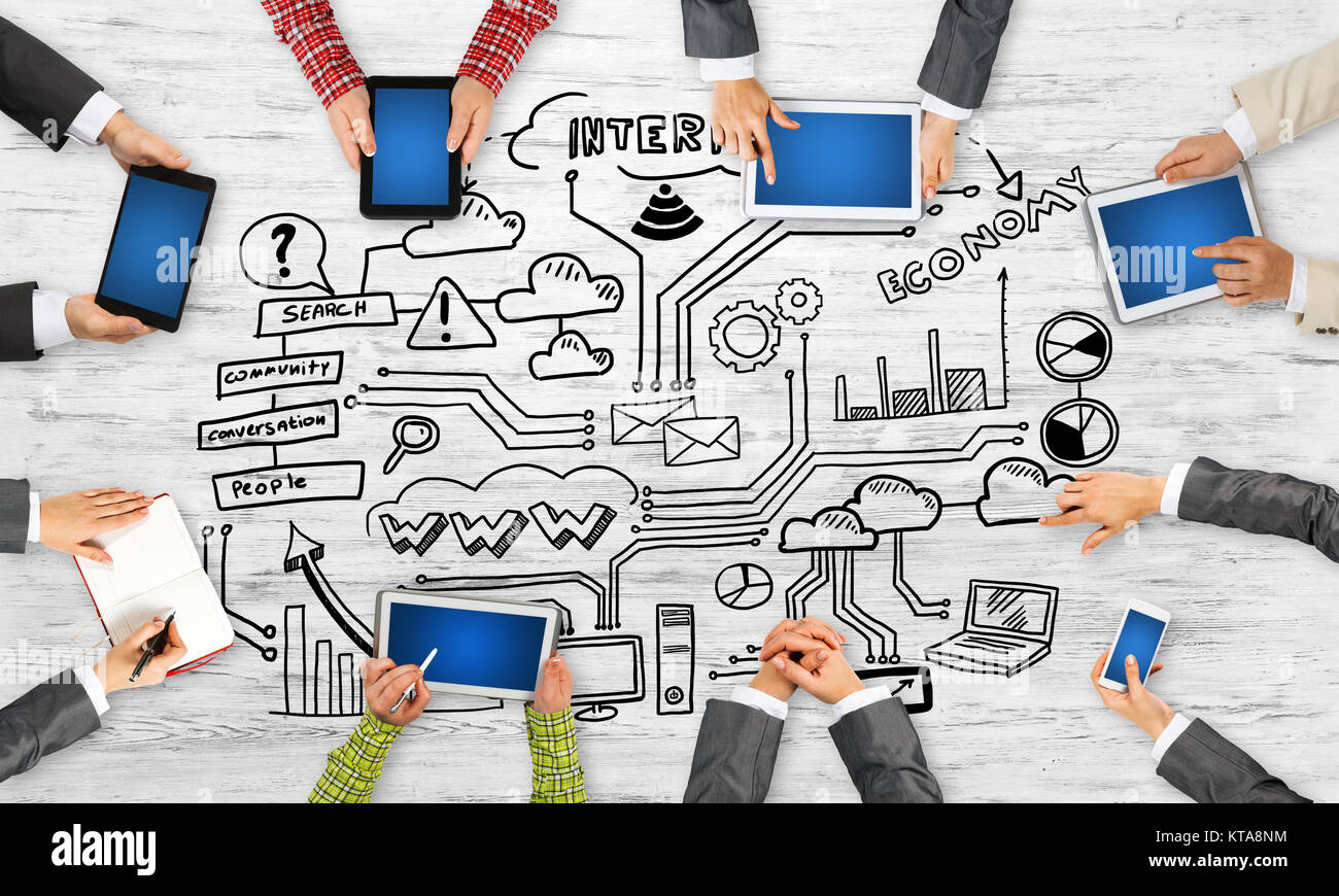 Group of people with devices in hands working together as symbol of ...