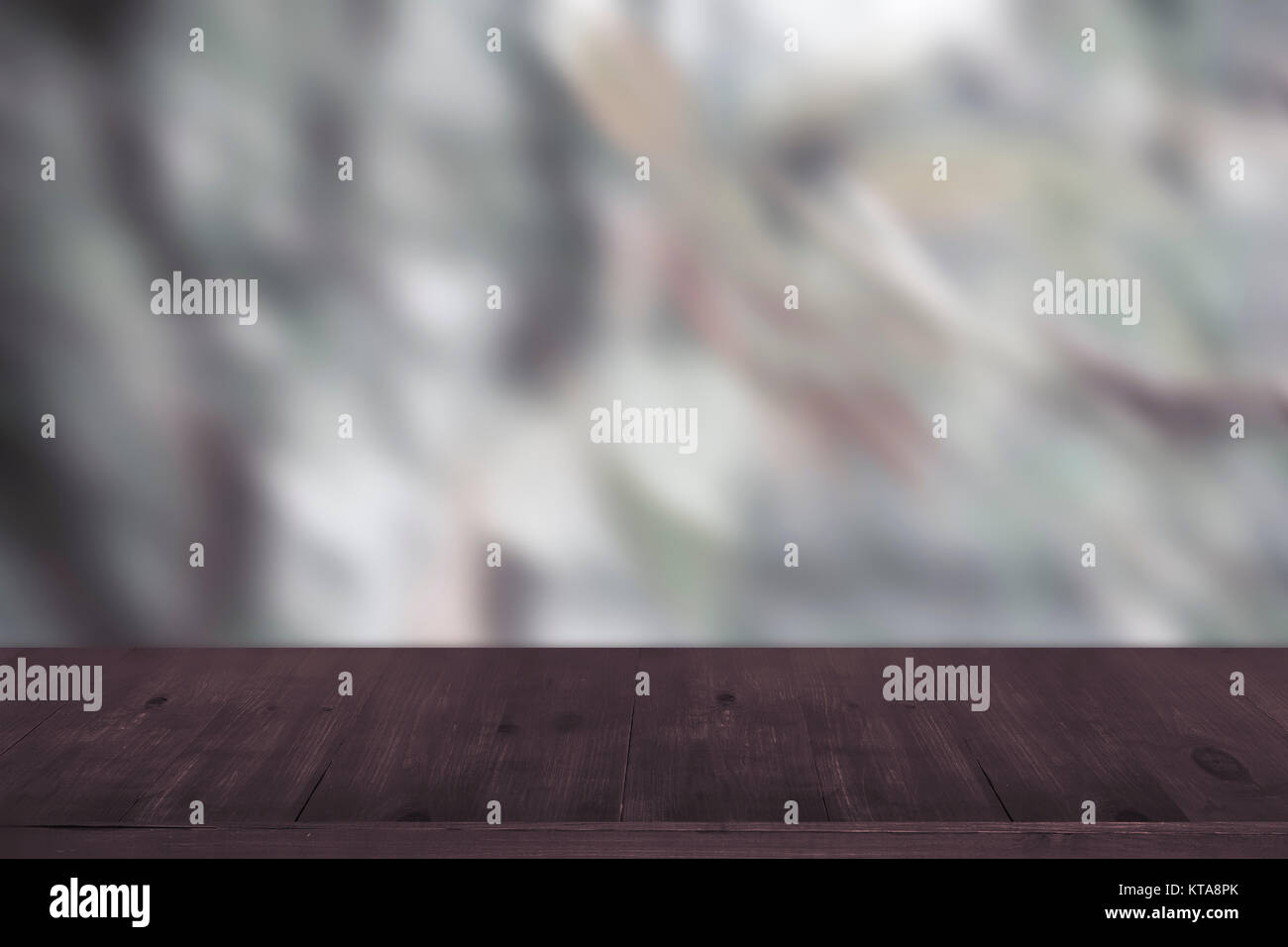Wooden surface on the background of blurred scenery outside the window ...