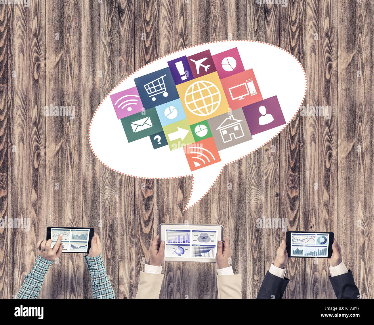 Group of three people with devices in hands working together as symbol ...