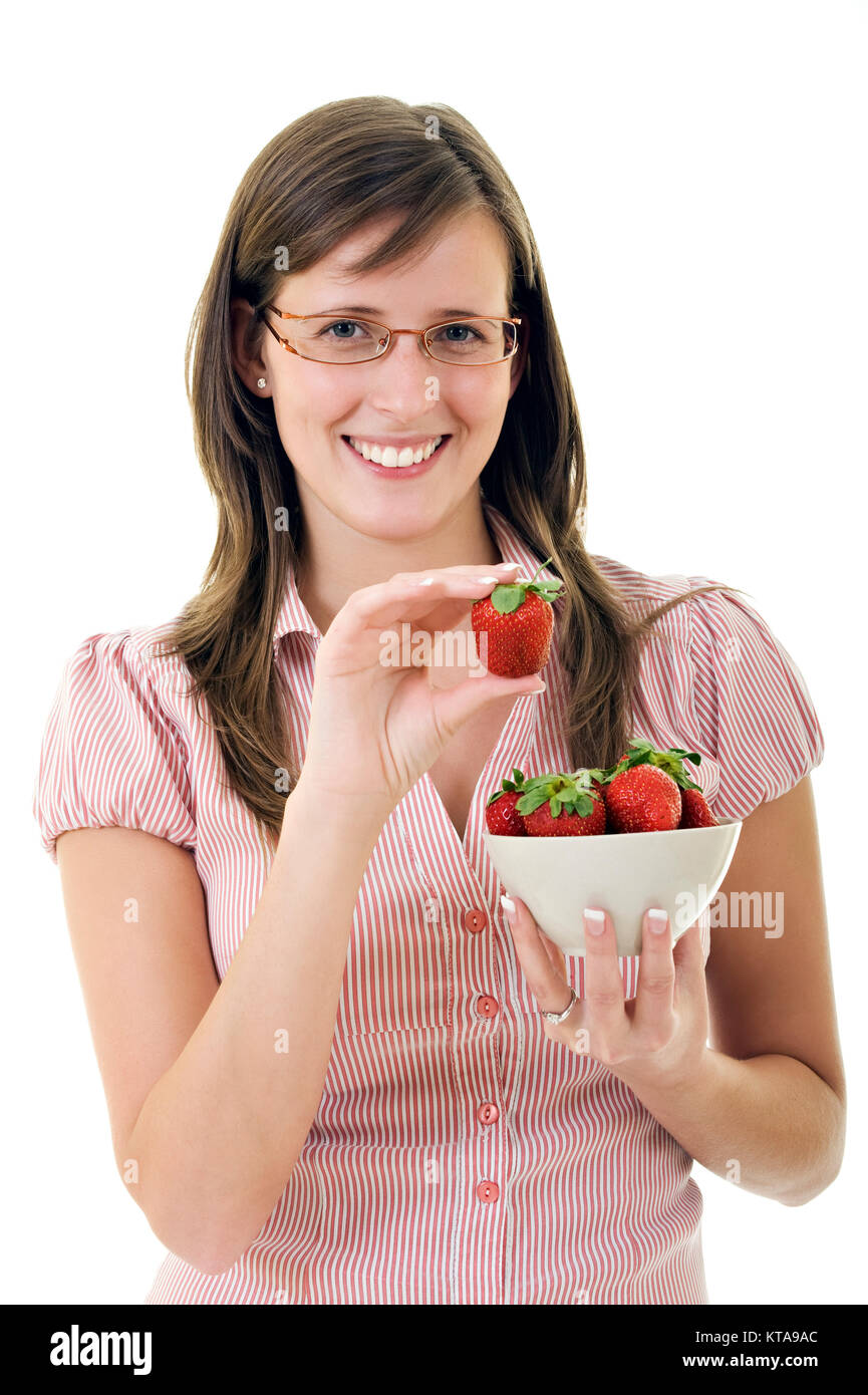 Young woman eating strawberry Stock Photo - Alamy
