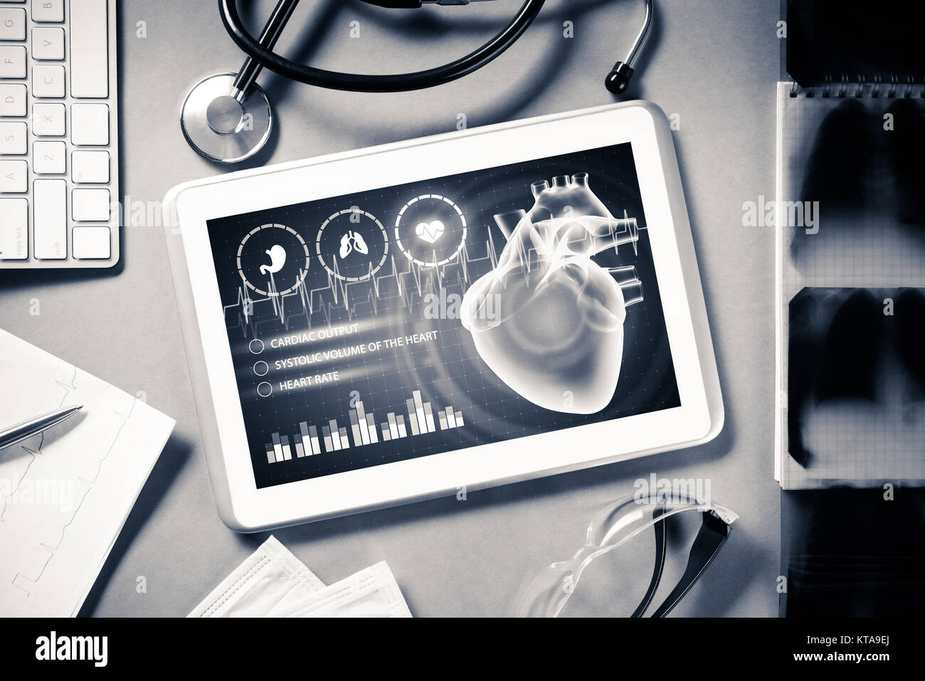 White tablet pc and doctor tools on gray surface Stock Photo - Alamy