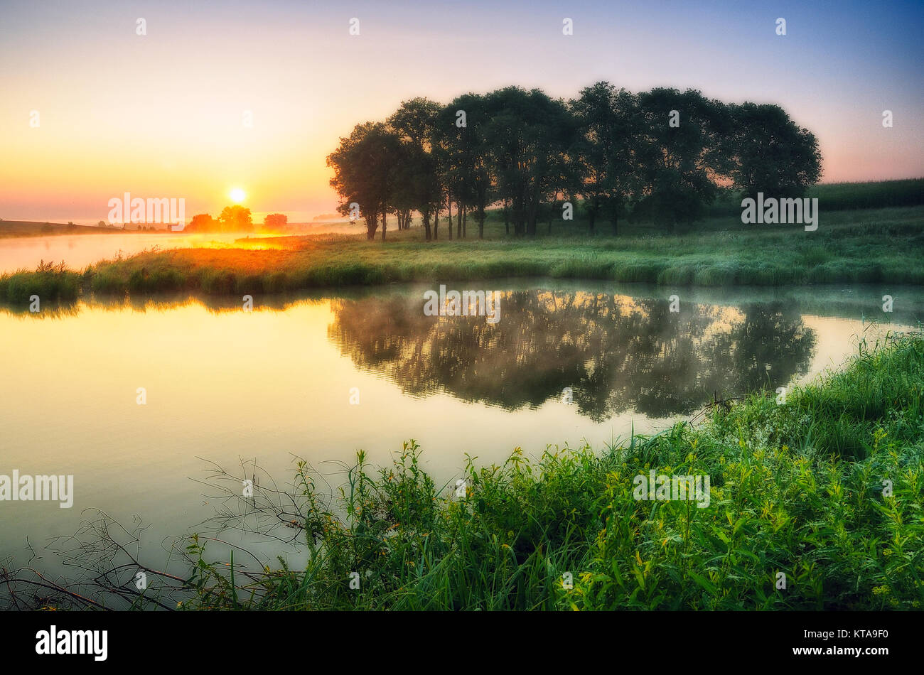 spring morning. a picturesque dawn by the river Stock Photo - Alamy