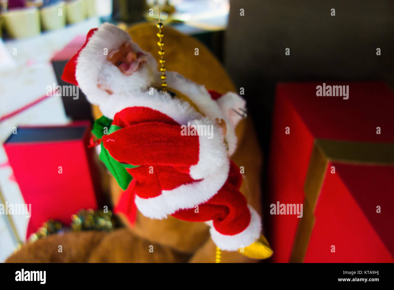 Santa clause hanging on christmas tree Stock Photo - Alamy