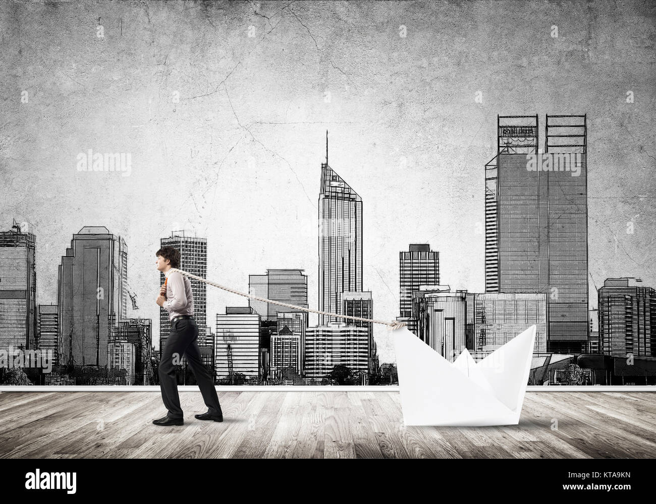 Successful businessman pulling with rope paper boat Stock Photo - Alamy