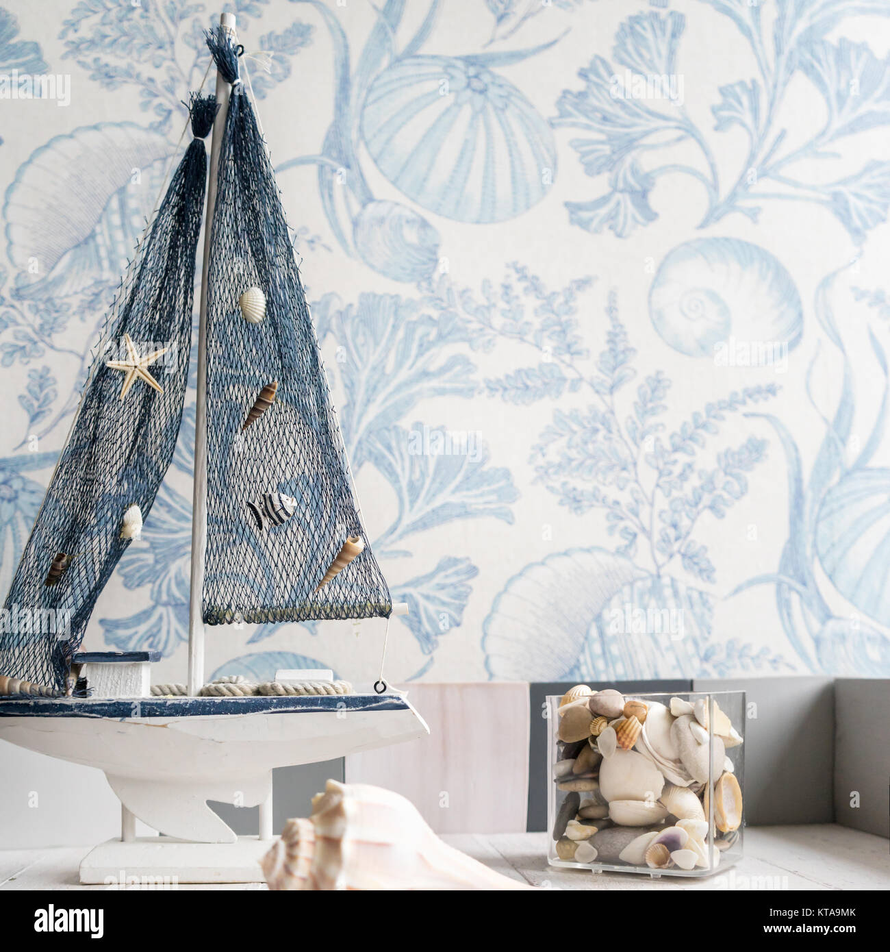 Sea theme decorations of the kids room, such as cute wooden boat, sea ...