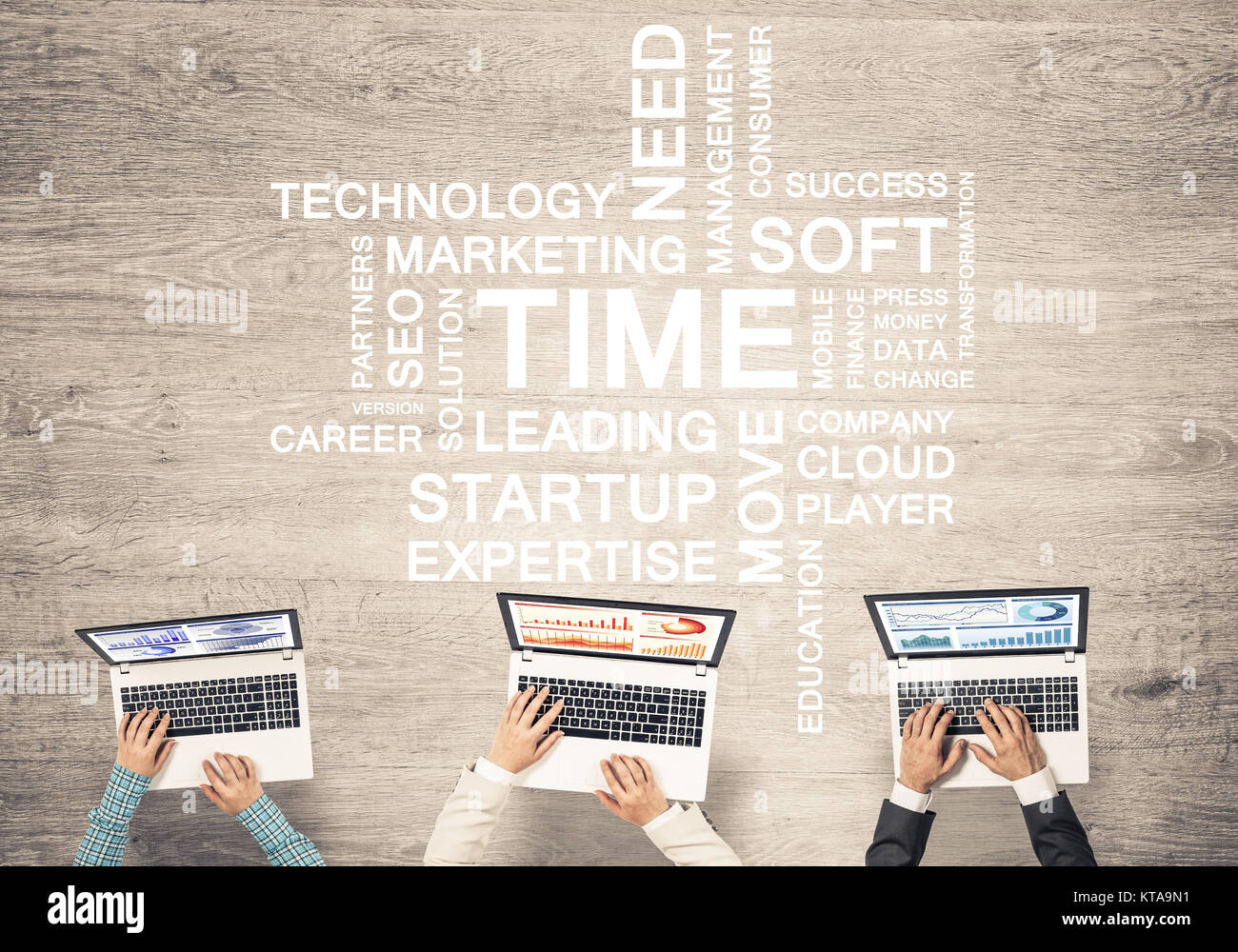 Group of three people with devices in hands working together as symbol ...