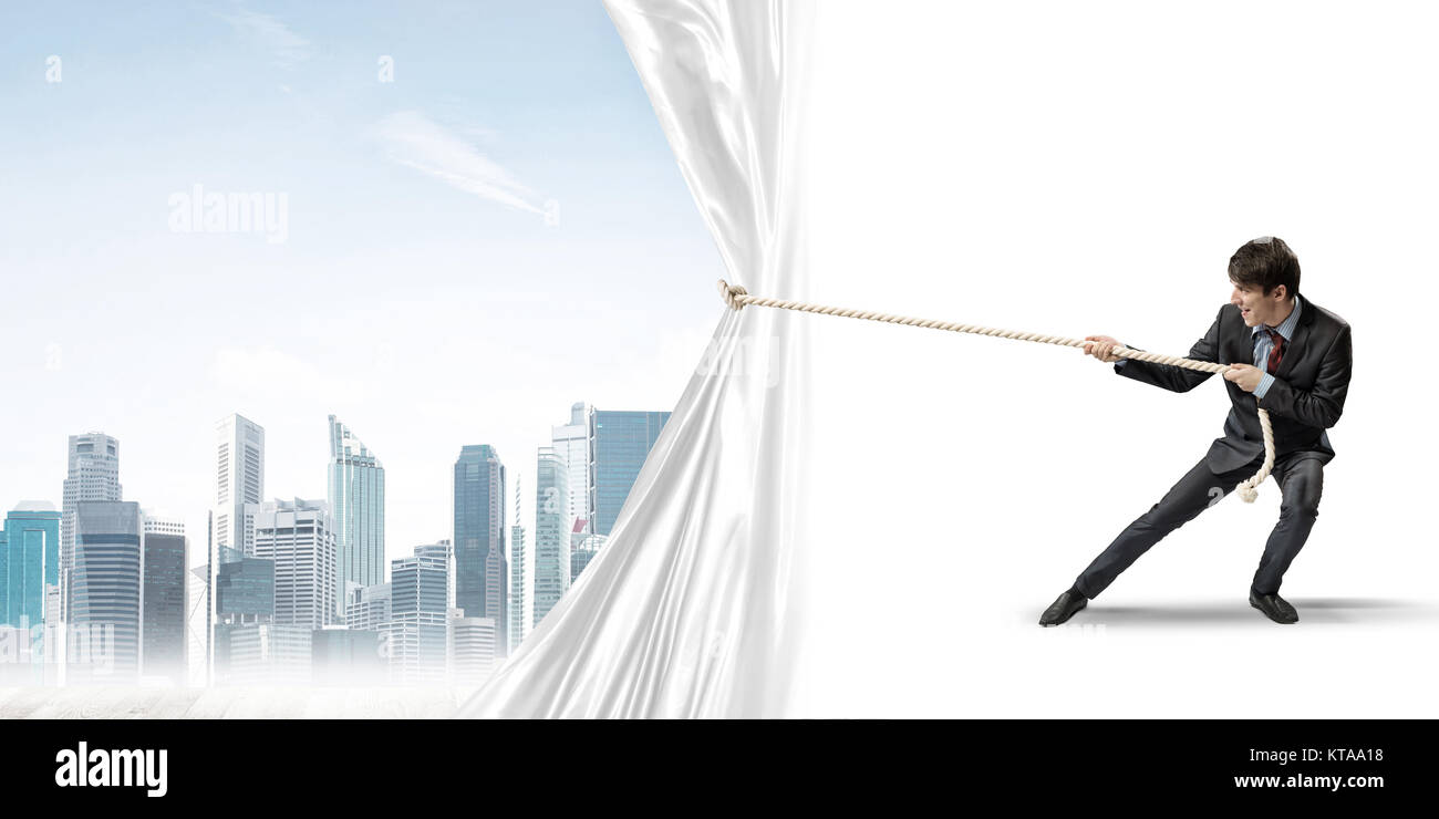 Businessman pulling white blank fabric. Place for text Stock Photo - Alamy