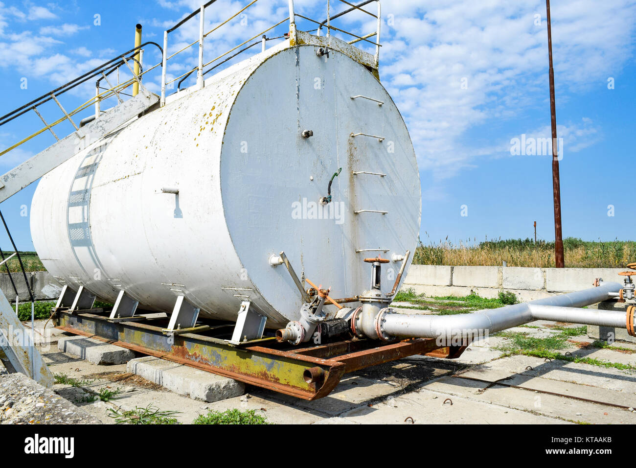 Reservoir for sludge of oil emulsion. Equipment at the oil field Stock ...