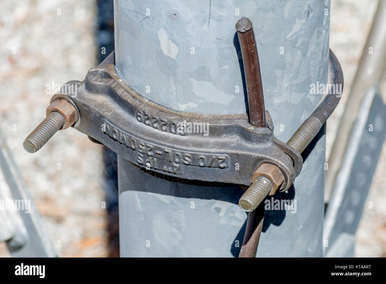 Grounding clamp and wire on a commercial radio tower Stock Photo - Alamy