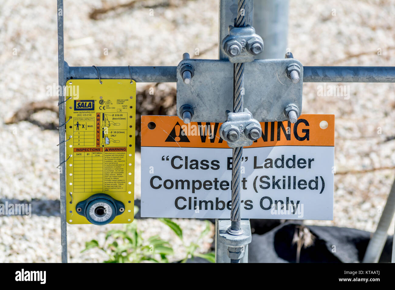 Warning sign for climbers at a radio tower Stock Photo - Alamy