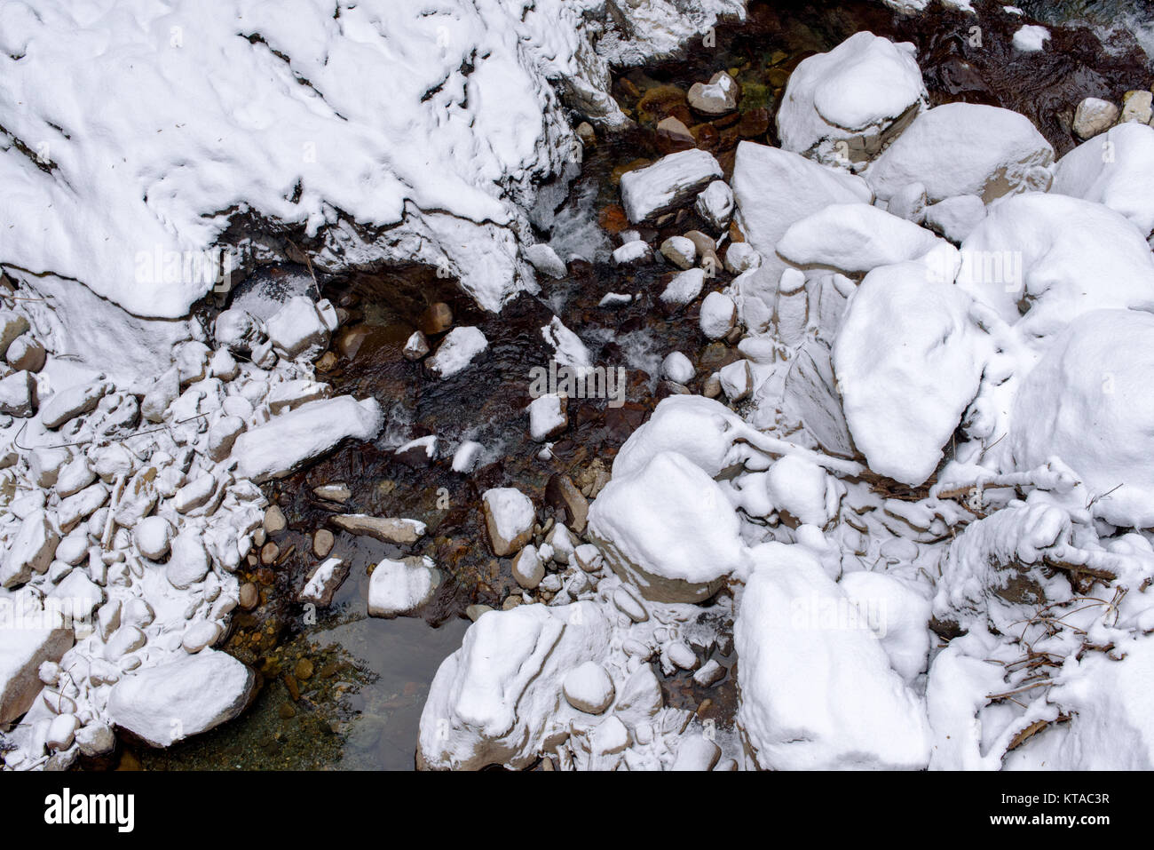 Winter art water ice covered creek stream rocks hi-res stock ...