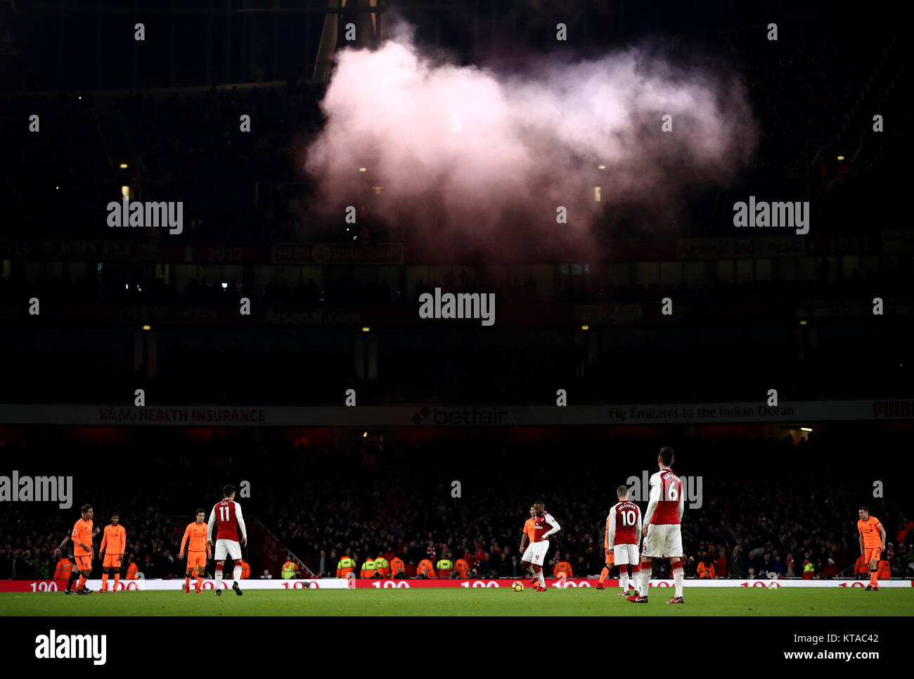 Smoke hangs in the air above the Premier League match at the Emirates ...