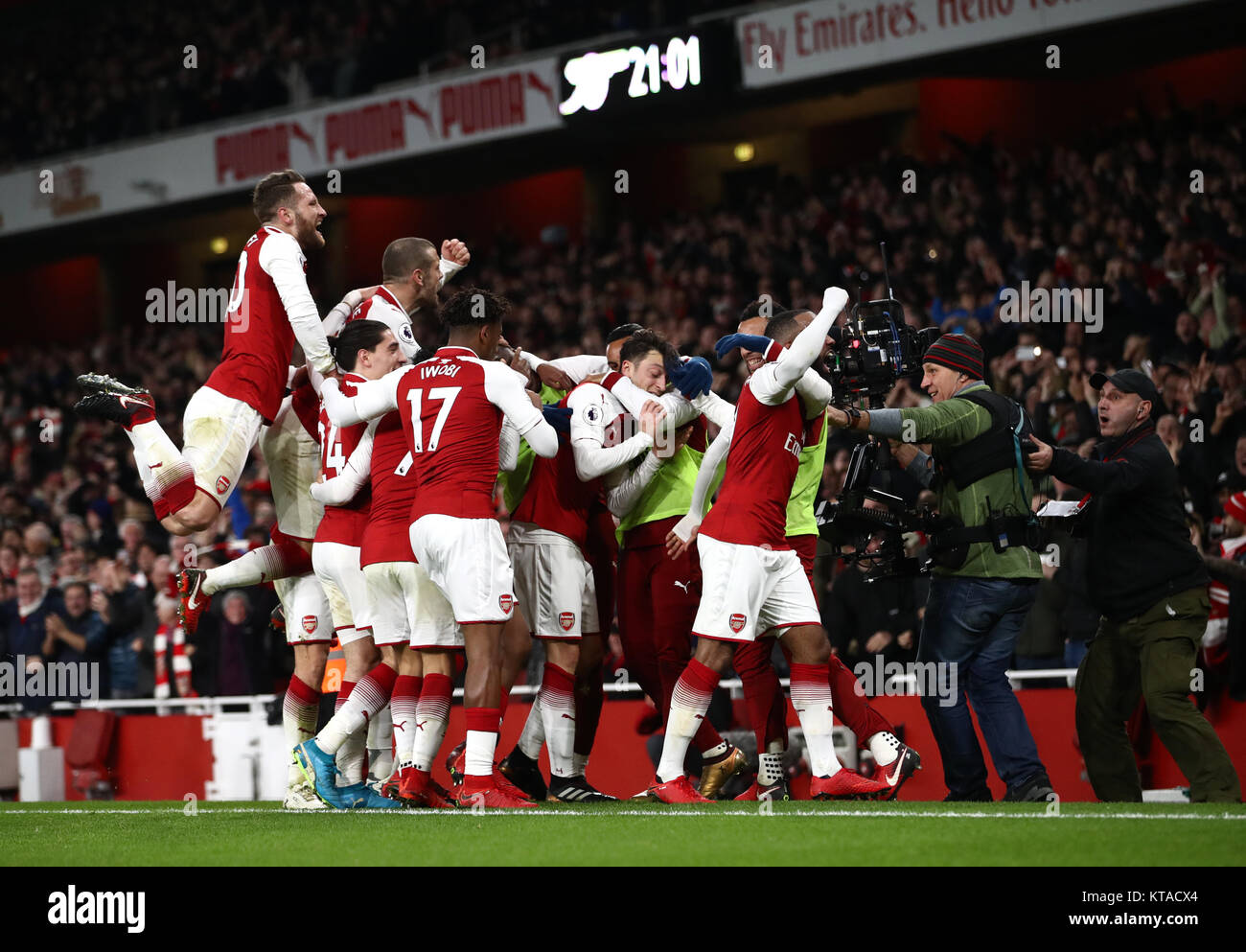 Arsenal's Mesut Ozil celebrates scoring his side's third goal of the ...