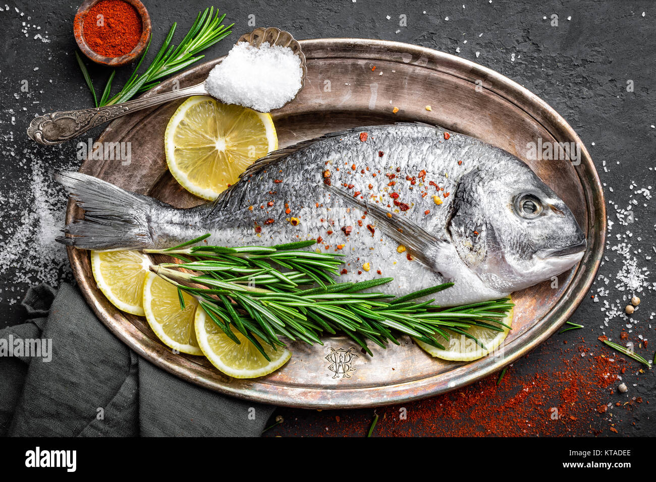 Fresh raw dorado fish with ingredients for cooking. Top view Stock ...