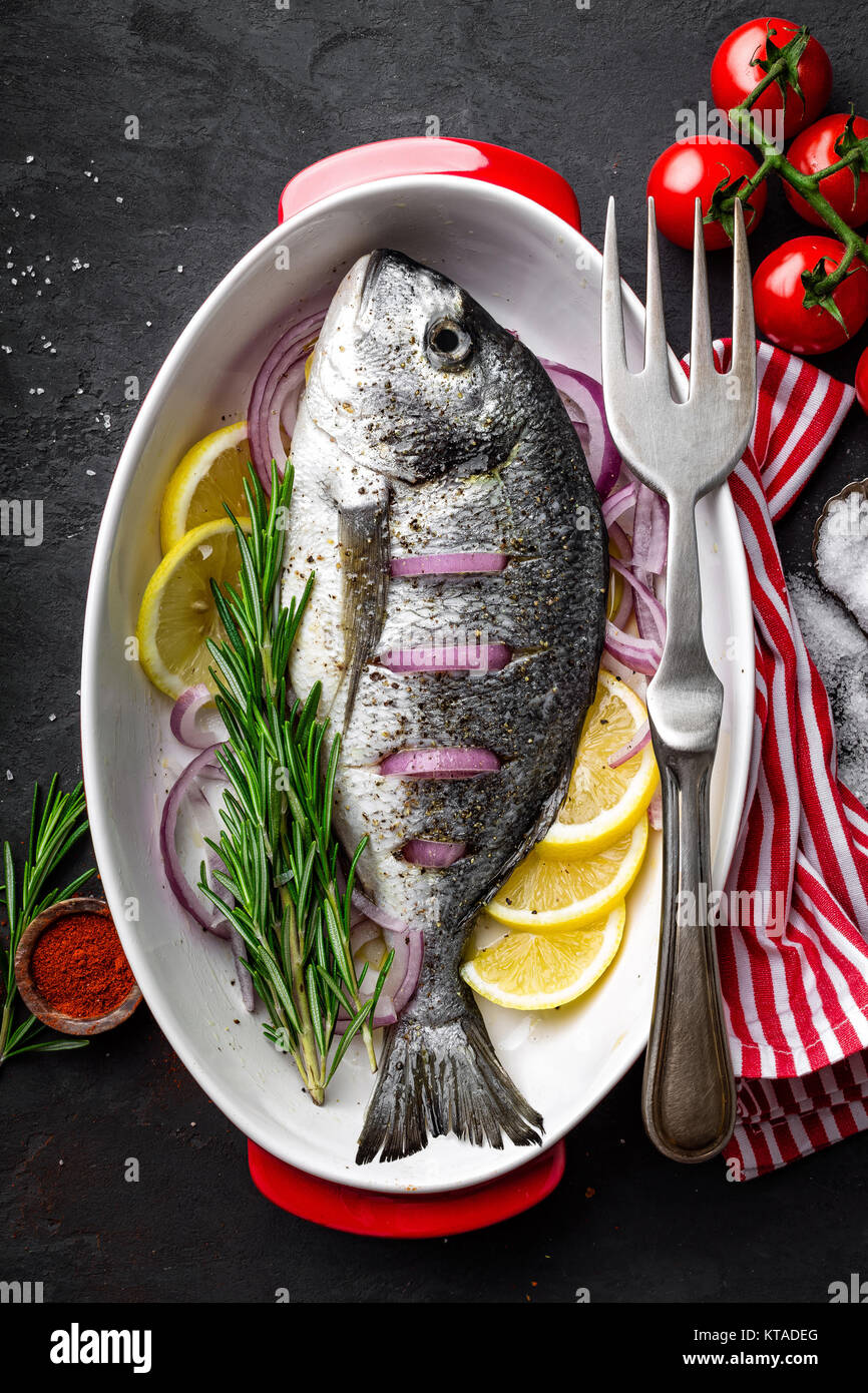 Fresh raw dorado fish with ingredients for cooking. Top view Stock ...