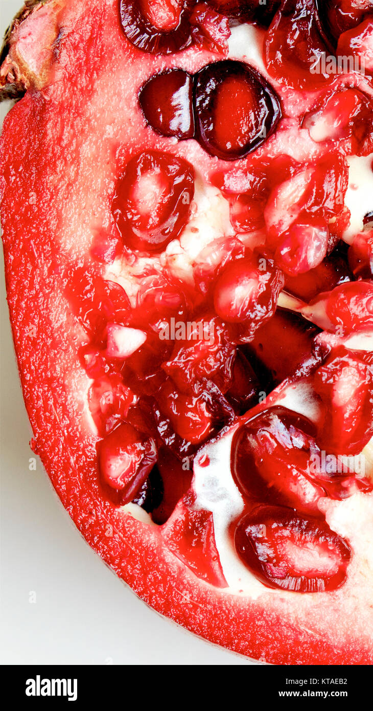 A slice of pomegranate juice showing pith and seeds Stock Photo - Alamy