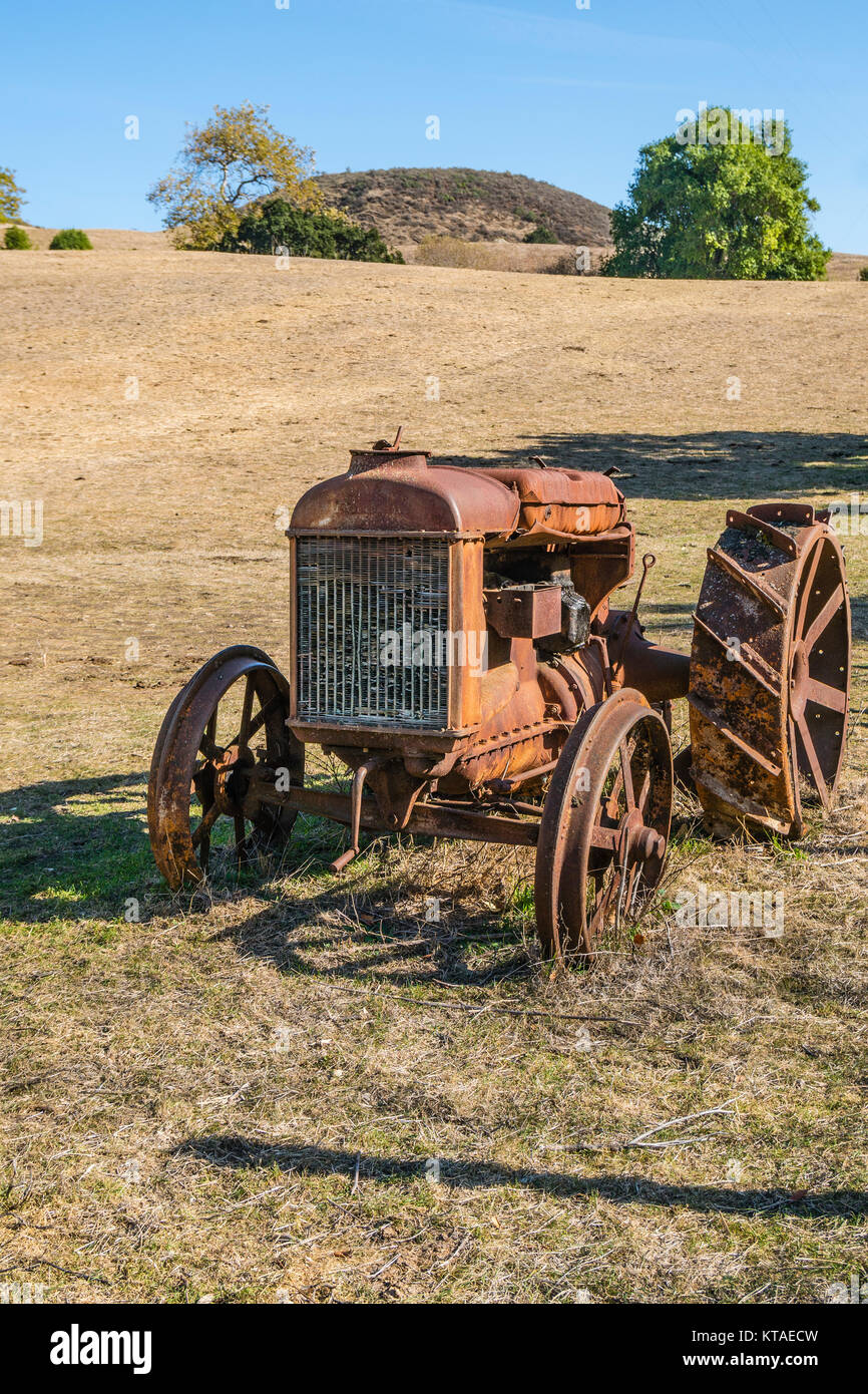 Old rusted tractor sitting in an open field in San Luis Obispo County ...
