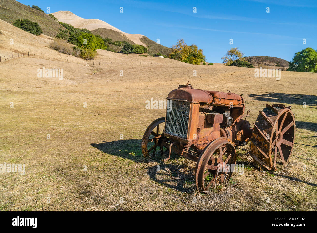Old rusted tractor sitting in an open field in San Luis Obispo County ...