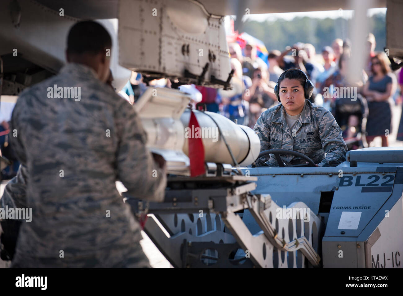 Airmen from the 23d Maintenance Group perform a weapons load demonstration in front of a crowd ...