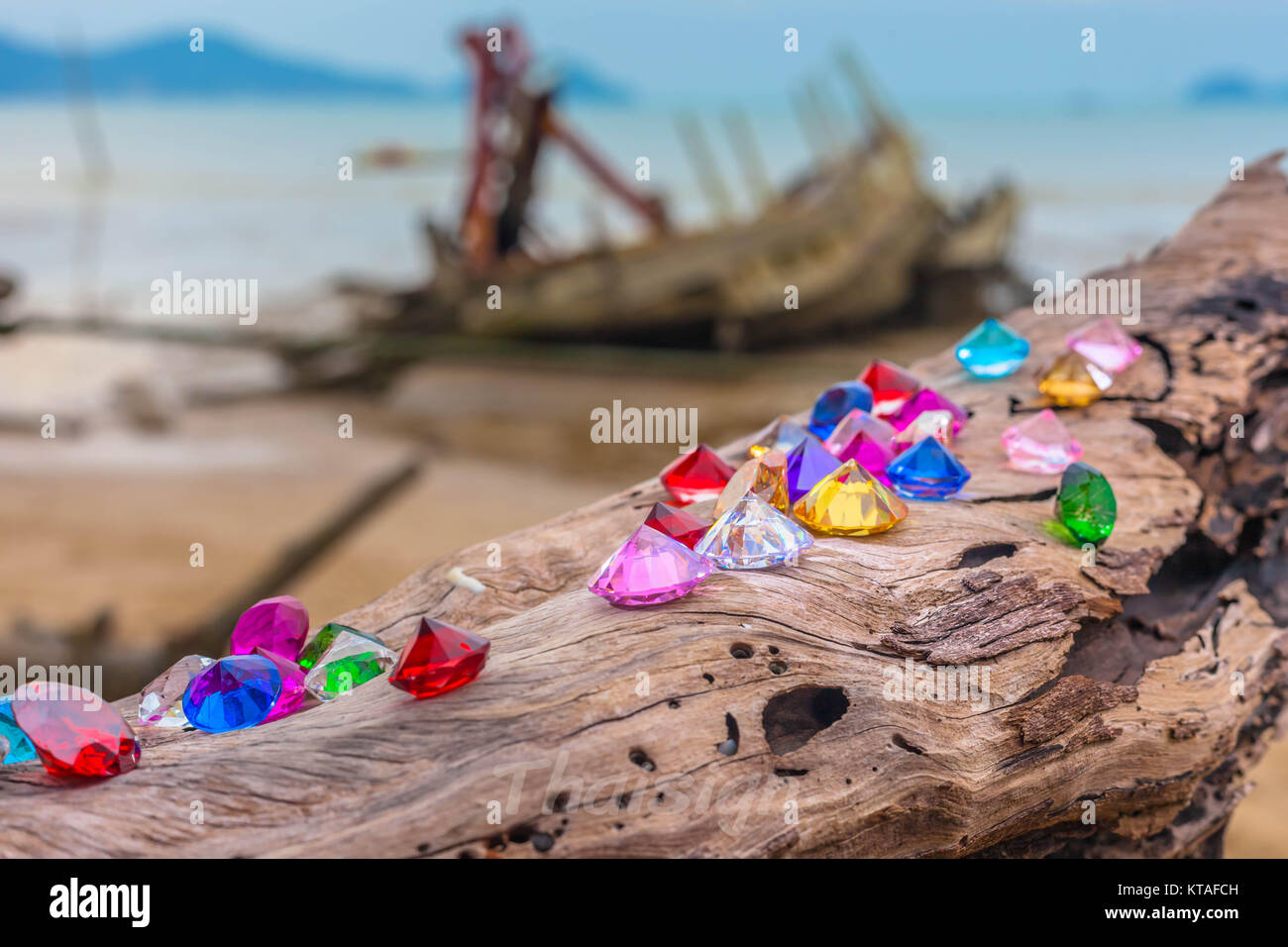 colorful diamonds are on the decayed timber of pine tree. It is a story ...