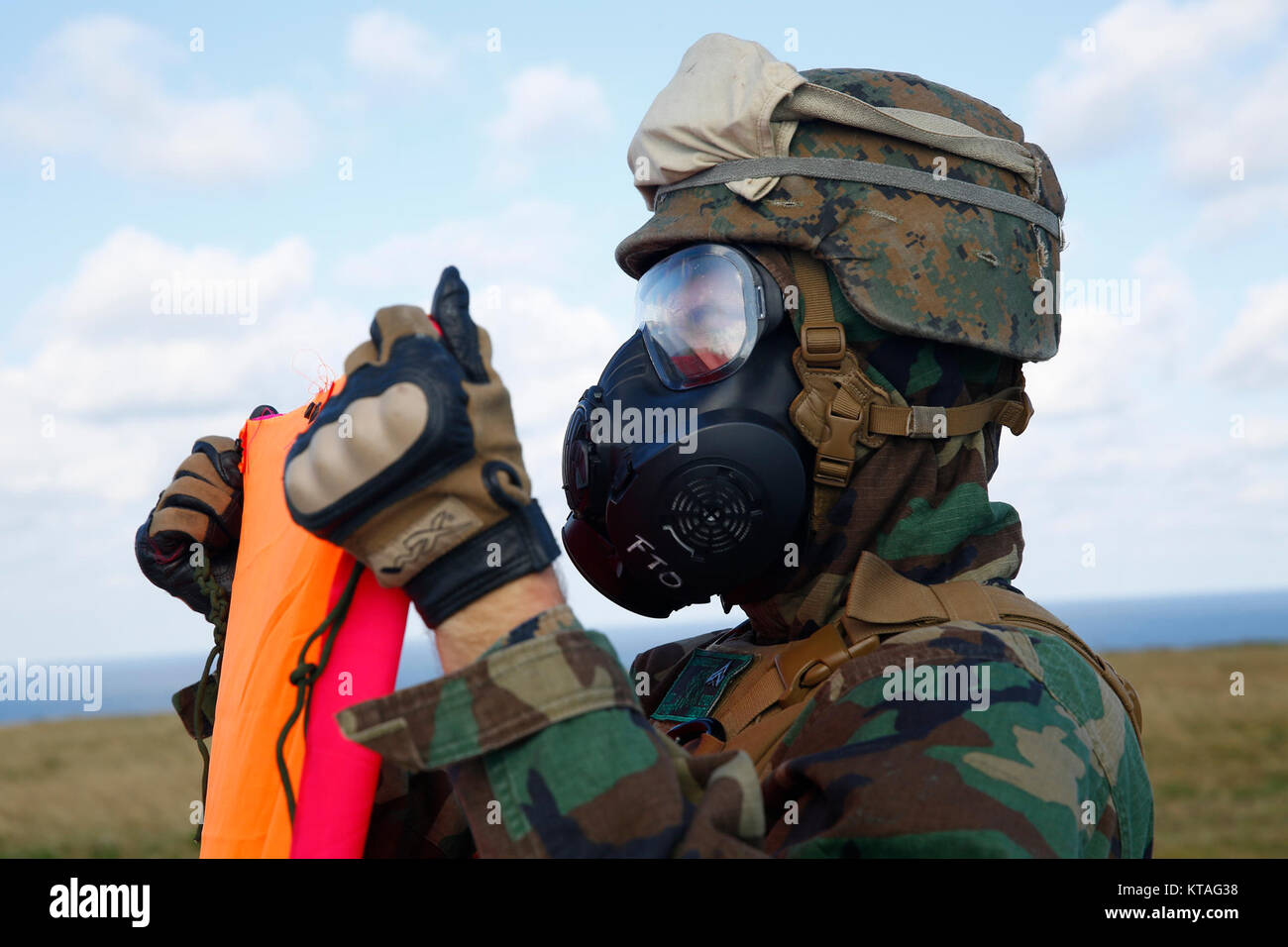 U.S. Marine Cpl. Daniel McGinness, an air traffic controller, aligns ...