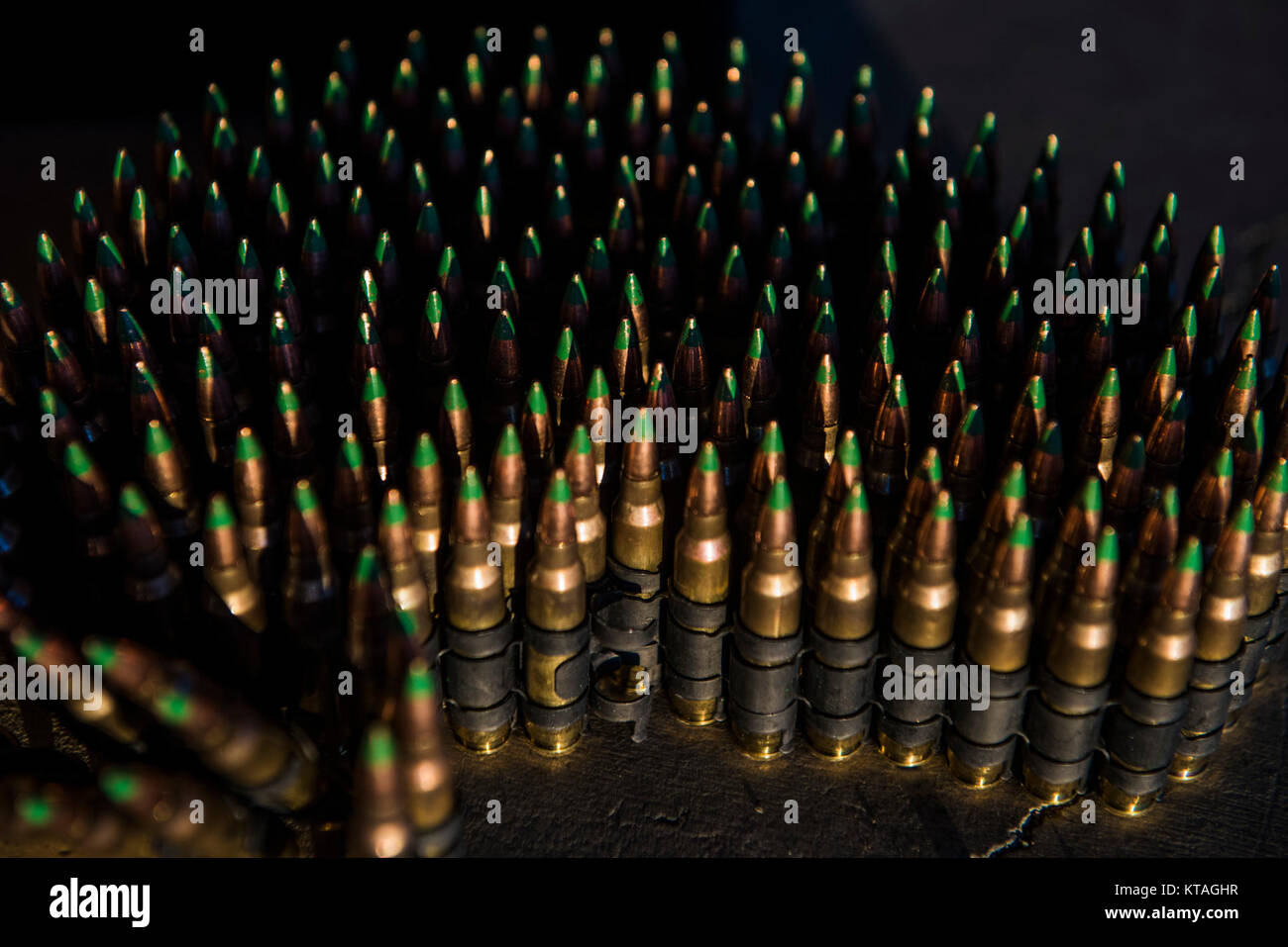 A pile of 7.62 millimeter rounds are coiled on the ground during ...
