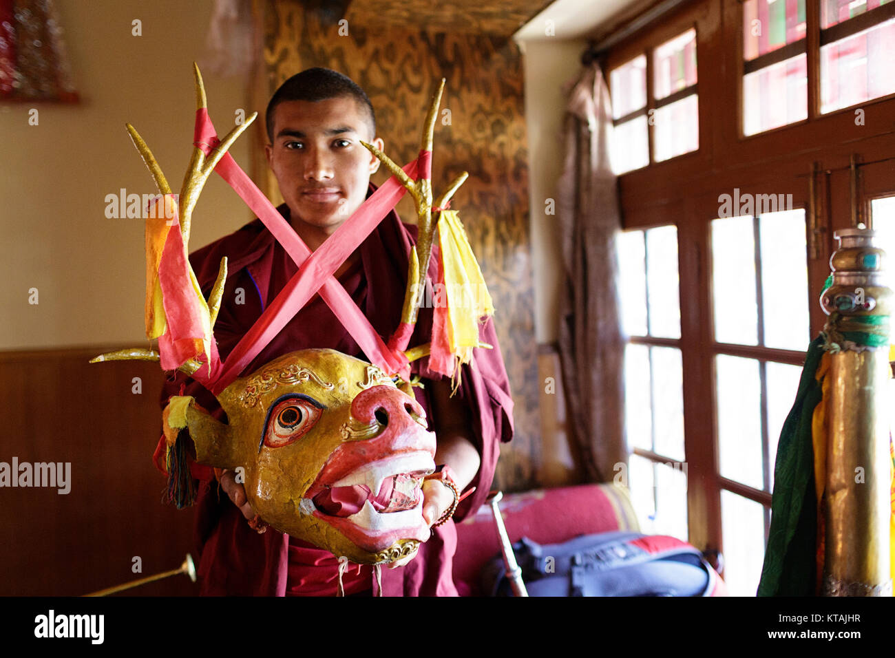 Monk from Yellow hat school showing the mask while preparing for the ...
