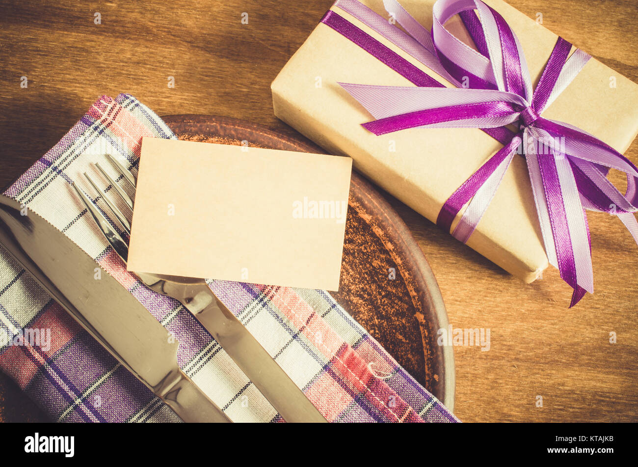 Dining Table Setting with Empty Tag and Present Stock Photo - Alamy