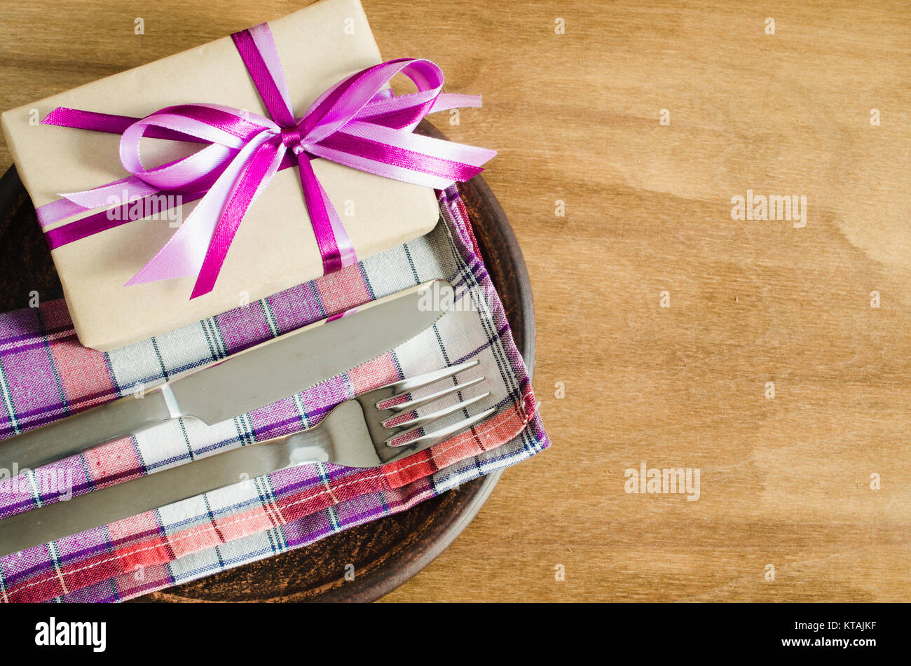 Festive Table Setting with Present Stock Photo - Alamy