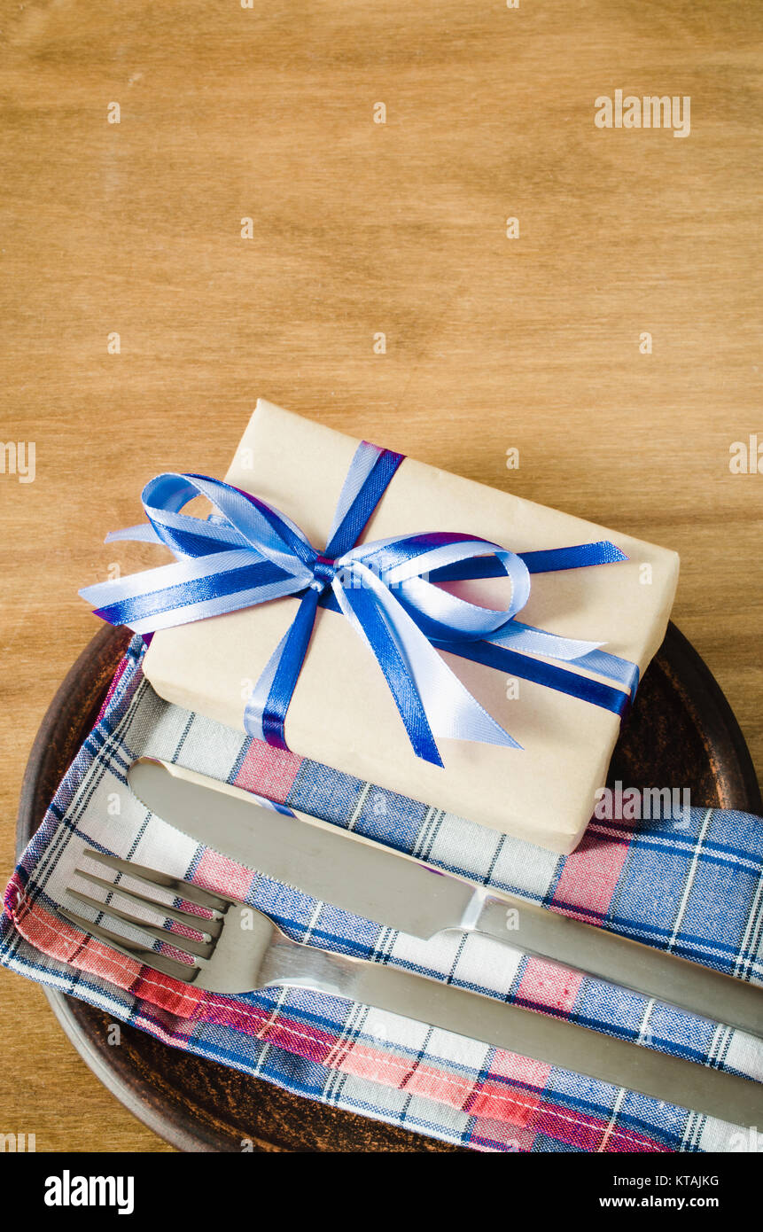Festive Table Setting with Present Stock Photo - Alamy
