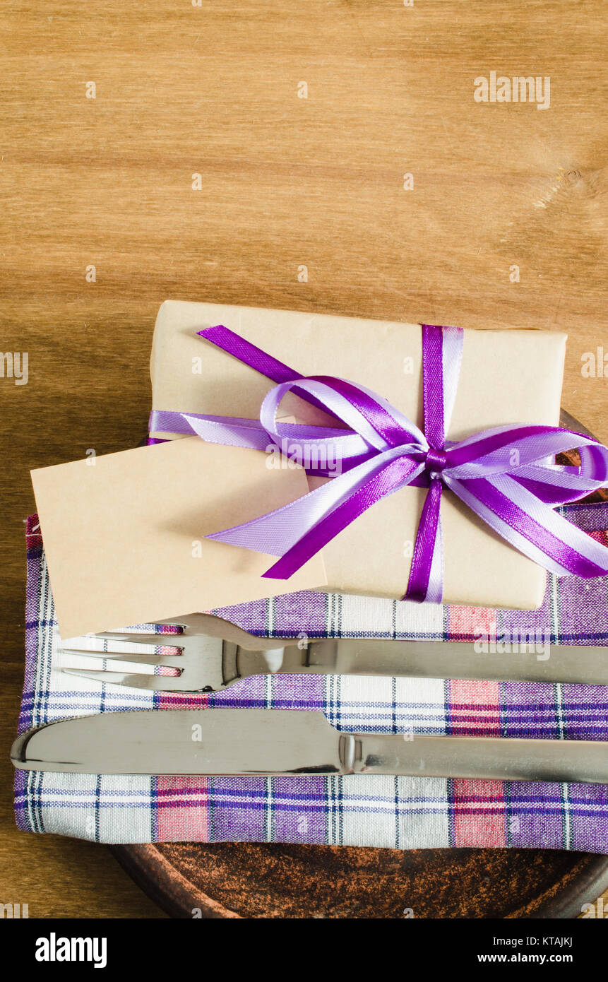 Dining Table Setting with Empty Tag and Present Stock Photo - Alamy