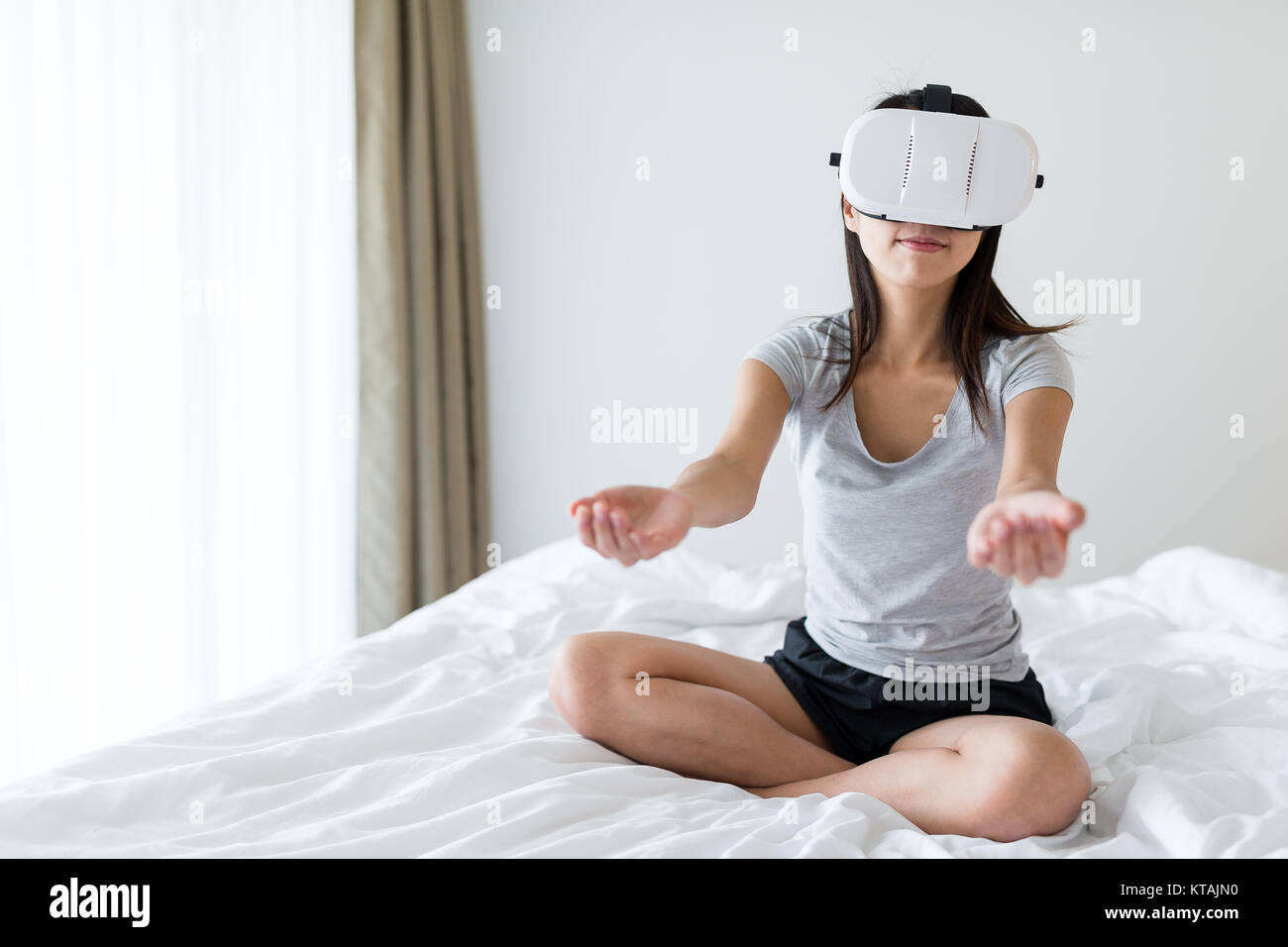 Woman enjoy playing VR at home Stock Photo - Alamy