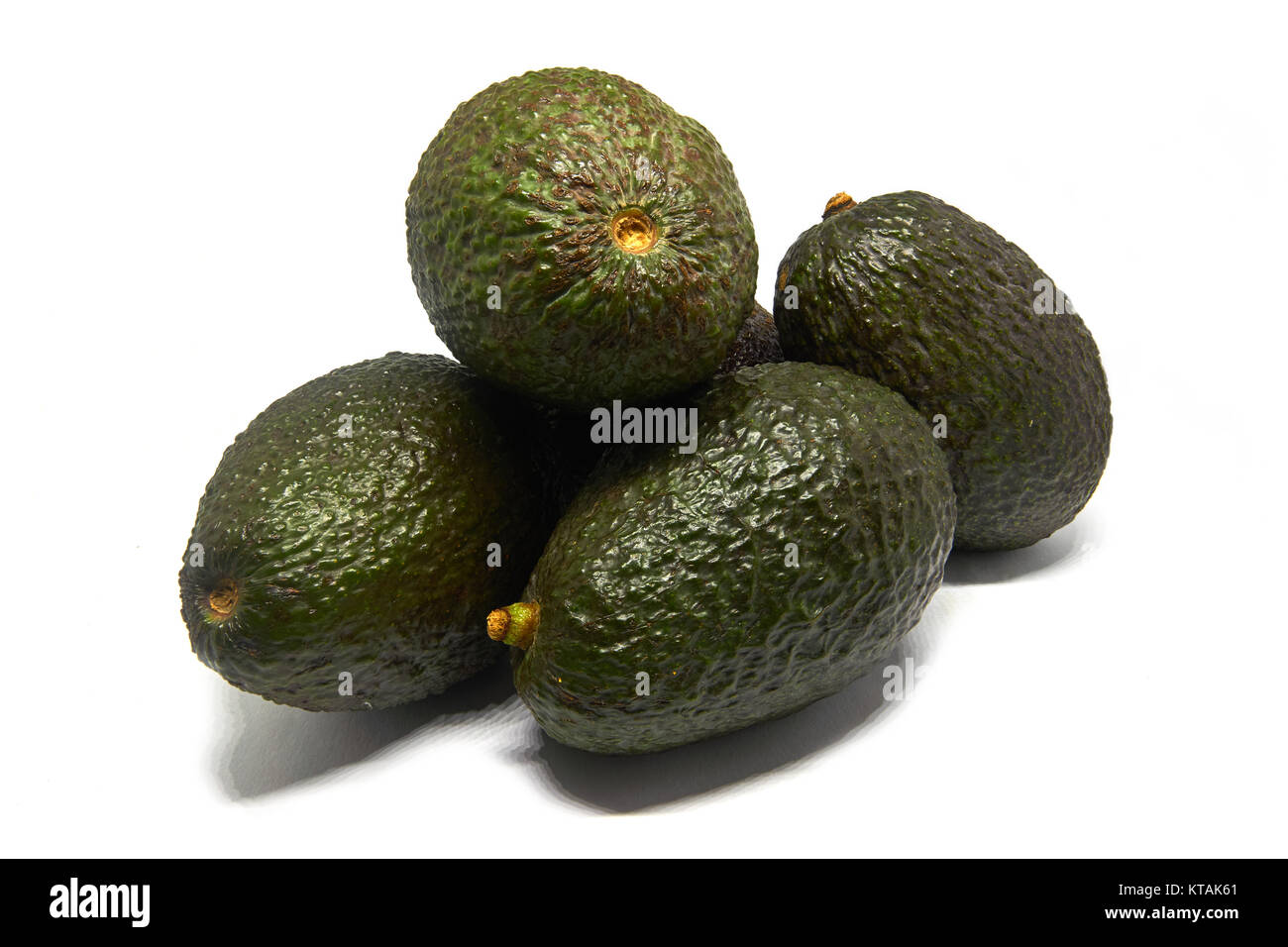 five Fresh Avocados isolated on a white background Stock Photo - Alamy