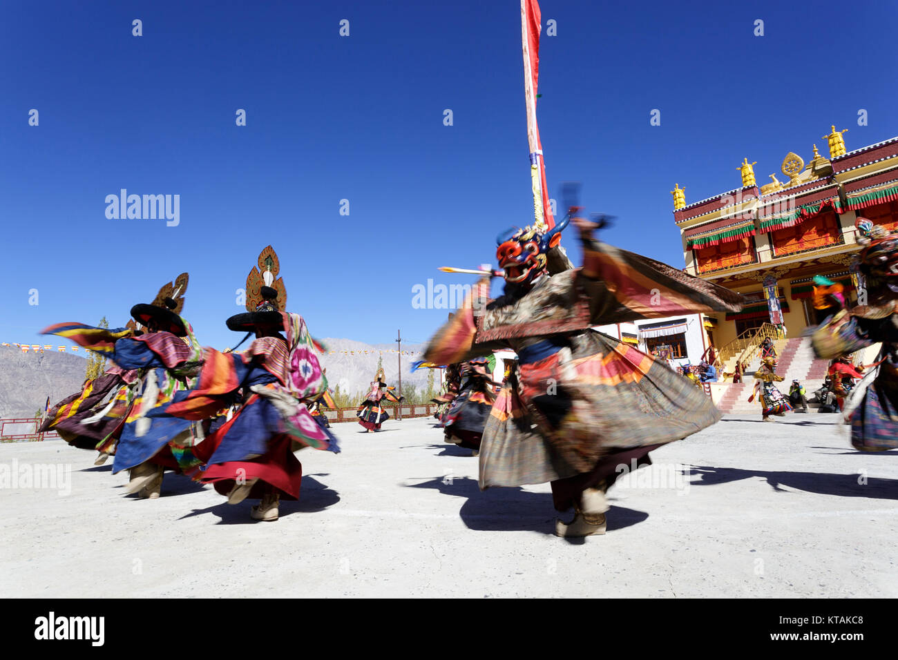 Buddhist monks performs masked dance at religious ceremony, scenic ...