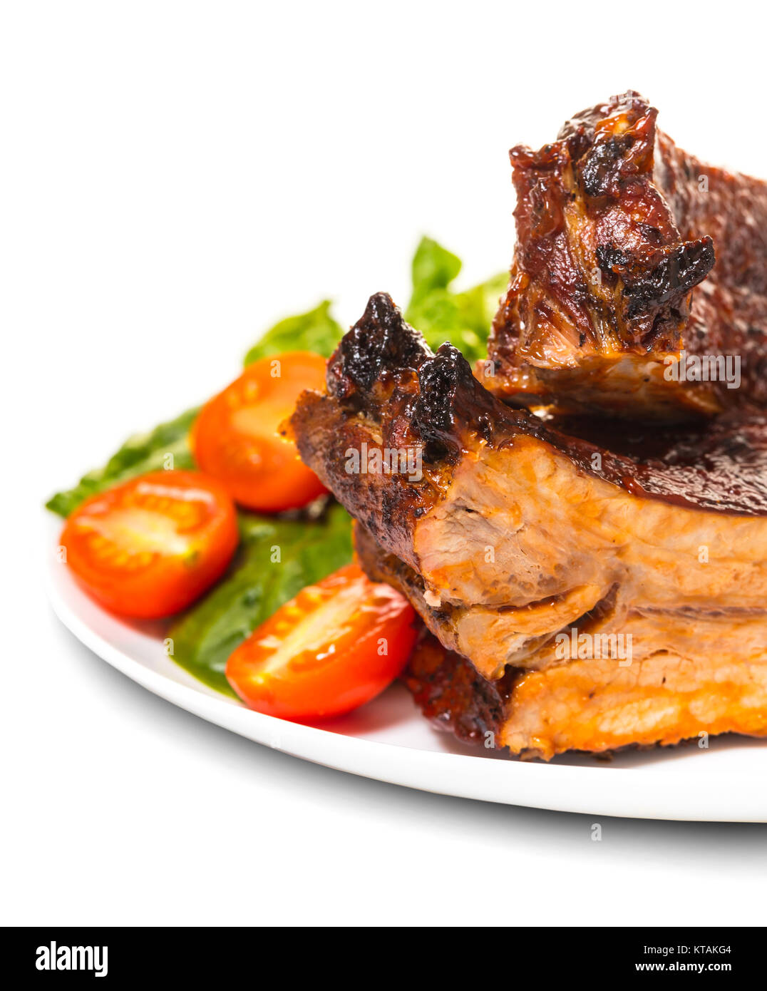 ribs grilled with salad on a white background Stock Photo - Alamy