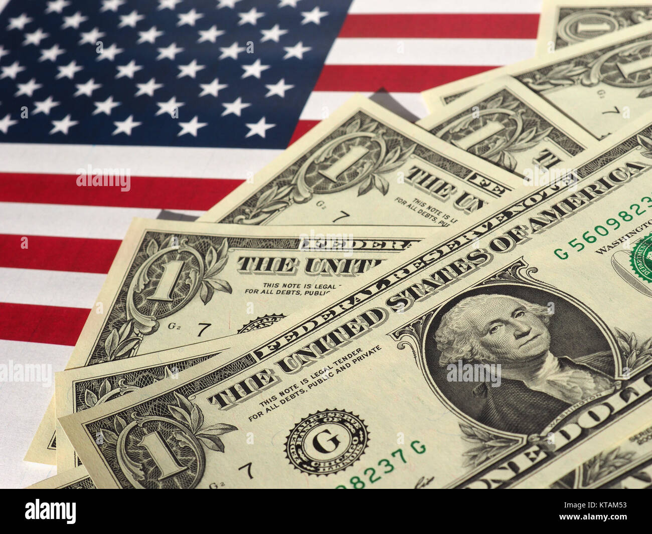 Dollar notes and flag of the United States Stock Photo - Alamy