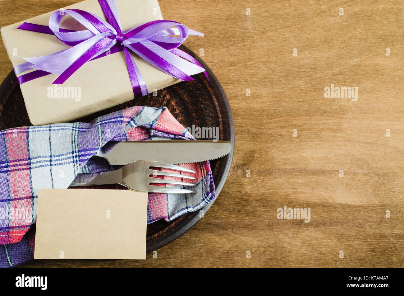Festive Table Setting with Postcard and Present Stock Photo - Alamy