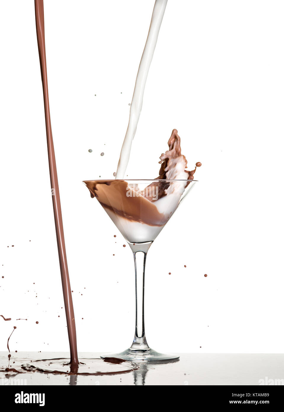 Chocolate falling in milk splashing hi-res stock photography and images ...