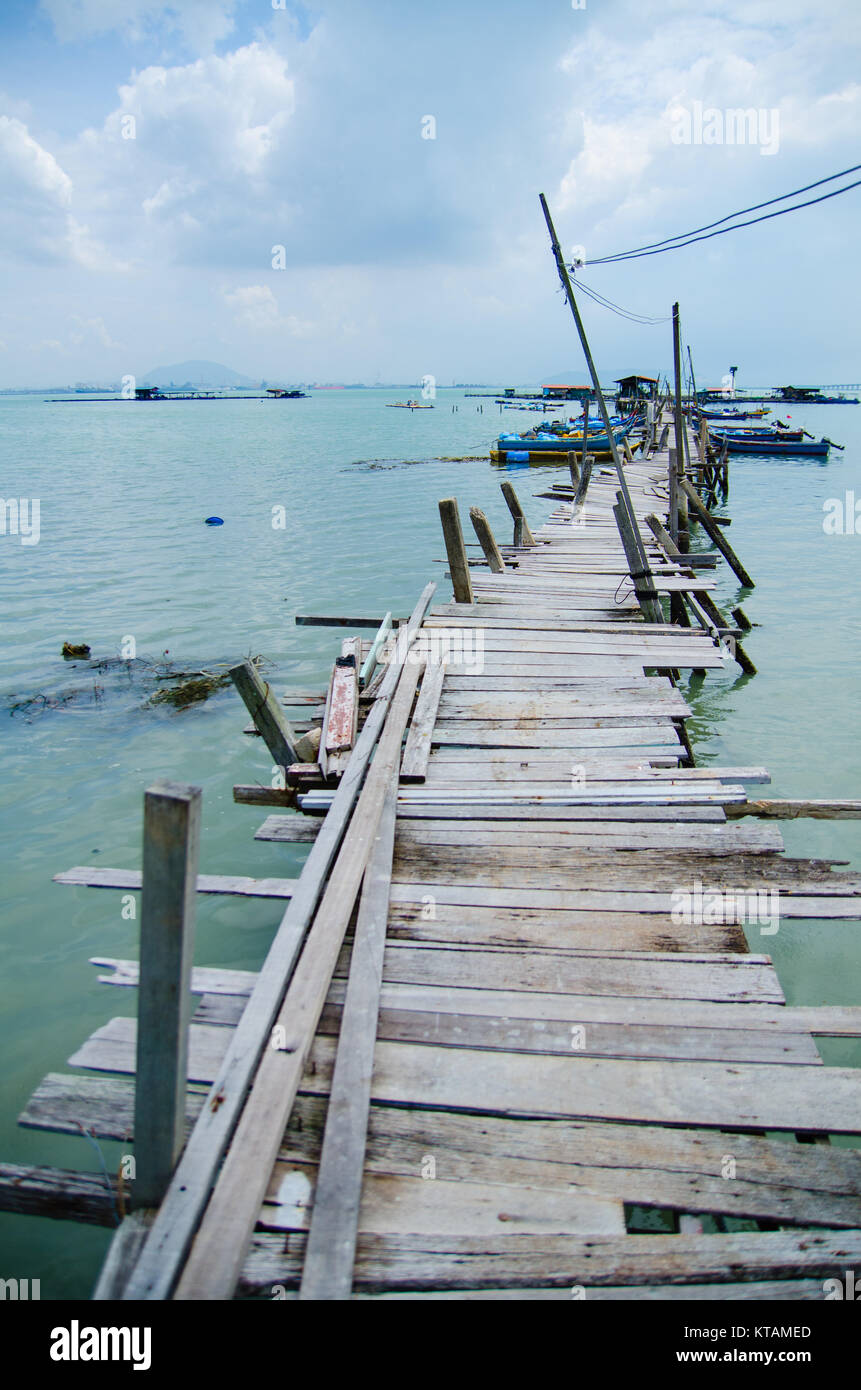 Wooden pier on the sea background Stock Photo - Alamy